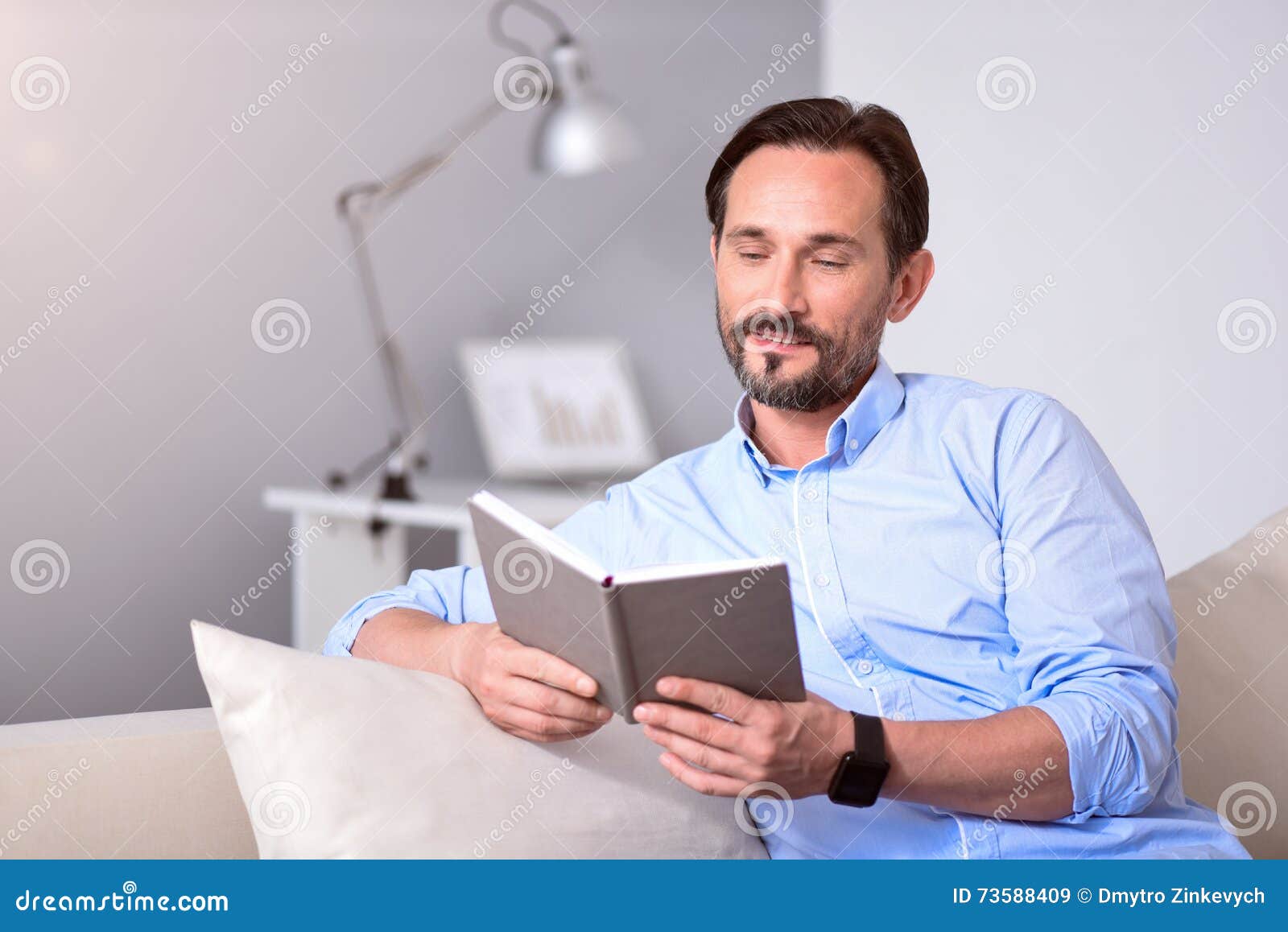 Man Looking at the Book while Sitting Stock Image - Image of rest ...