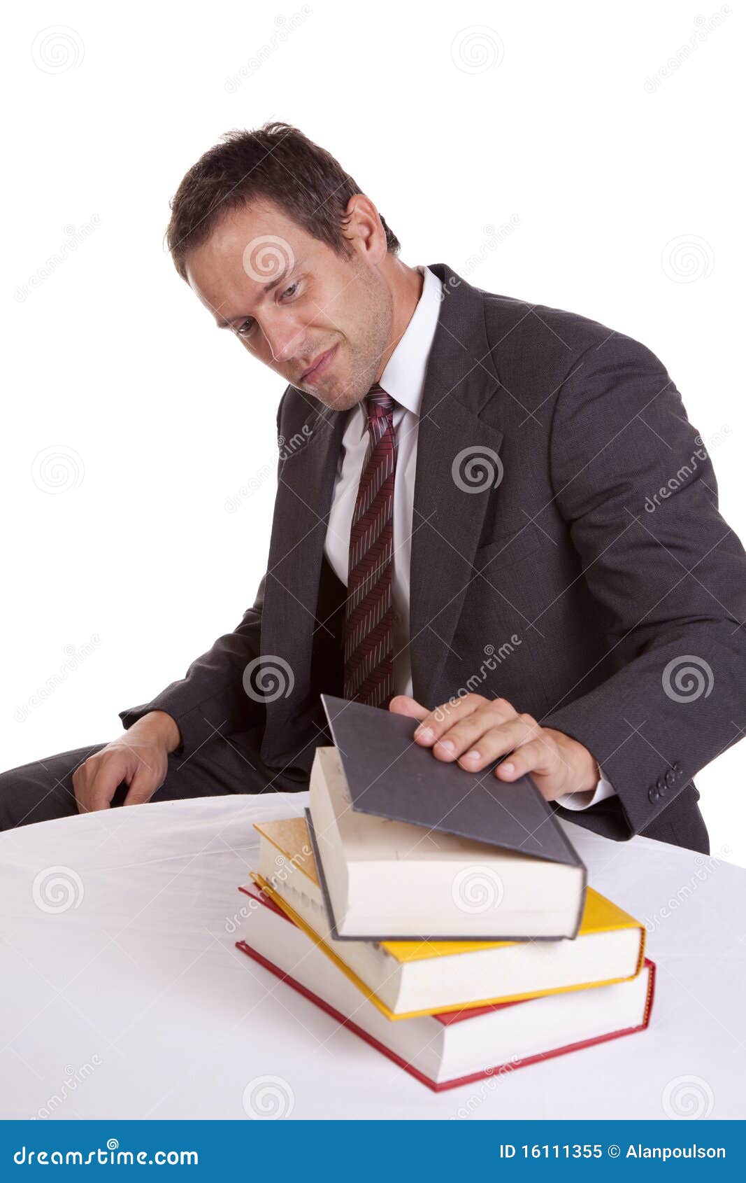 Man looking at books stock image. Image of novel, reach - 16111355