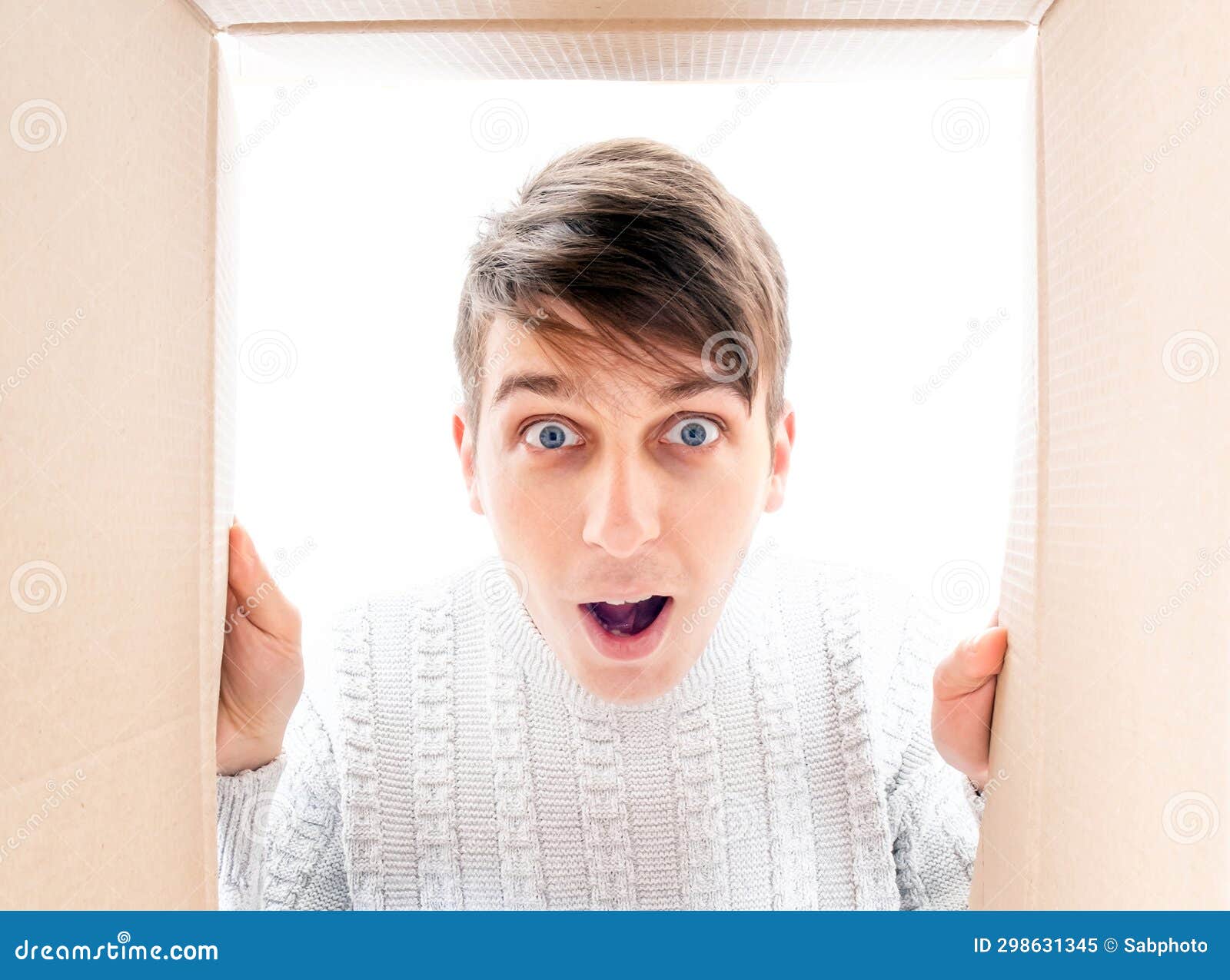 Man looking into a box stock image. Image of open, surprised - 298631345