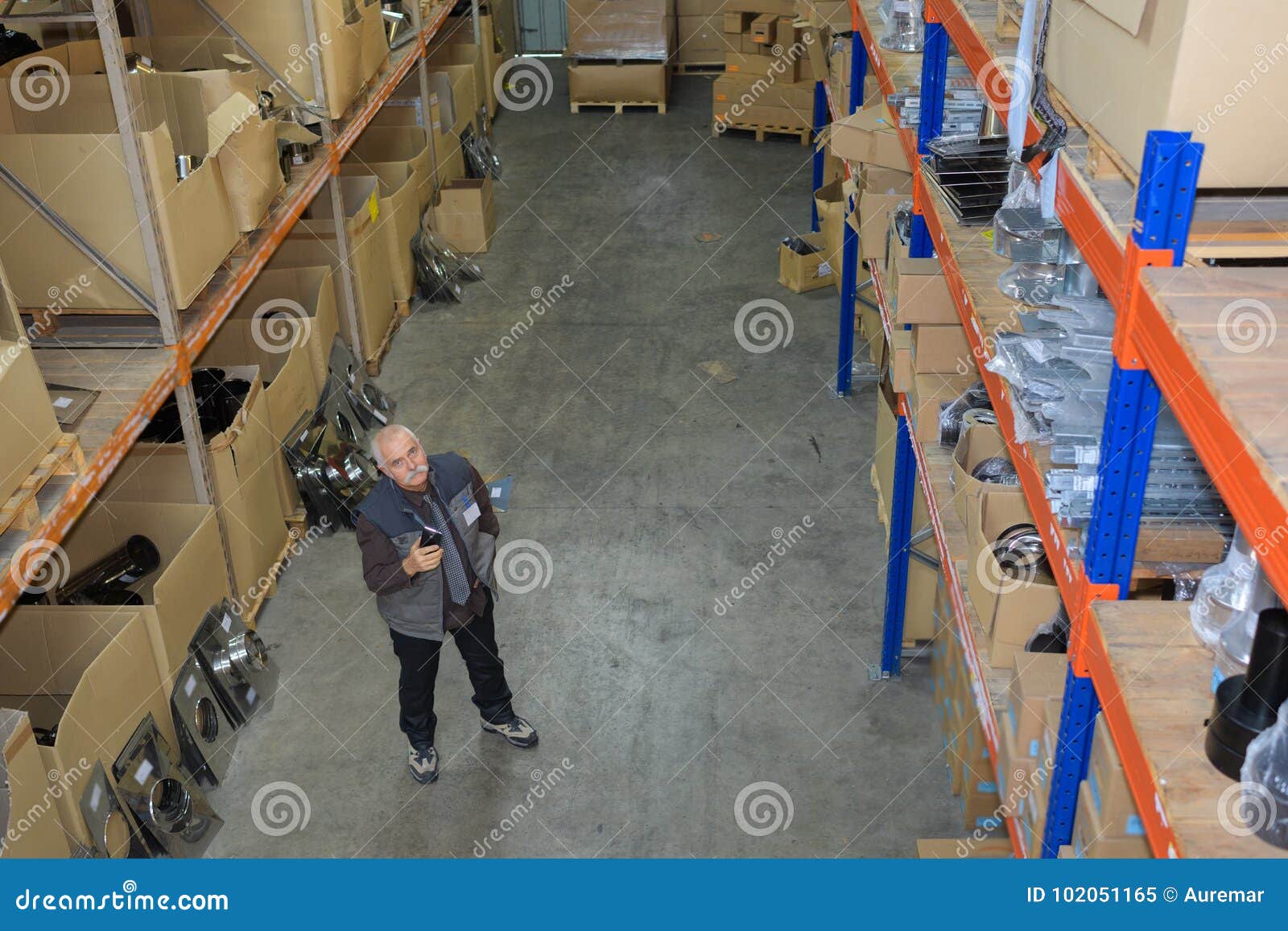 Man Looking at Boxes at Top Stock Image - Image of logistic, depot ...
