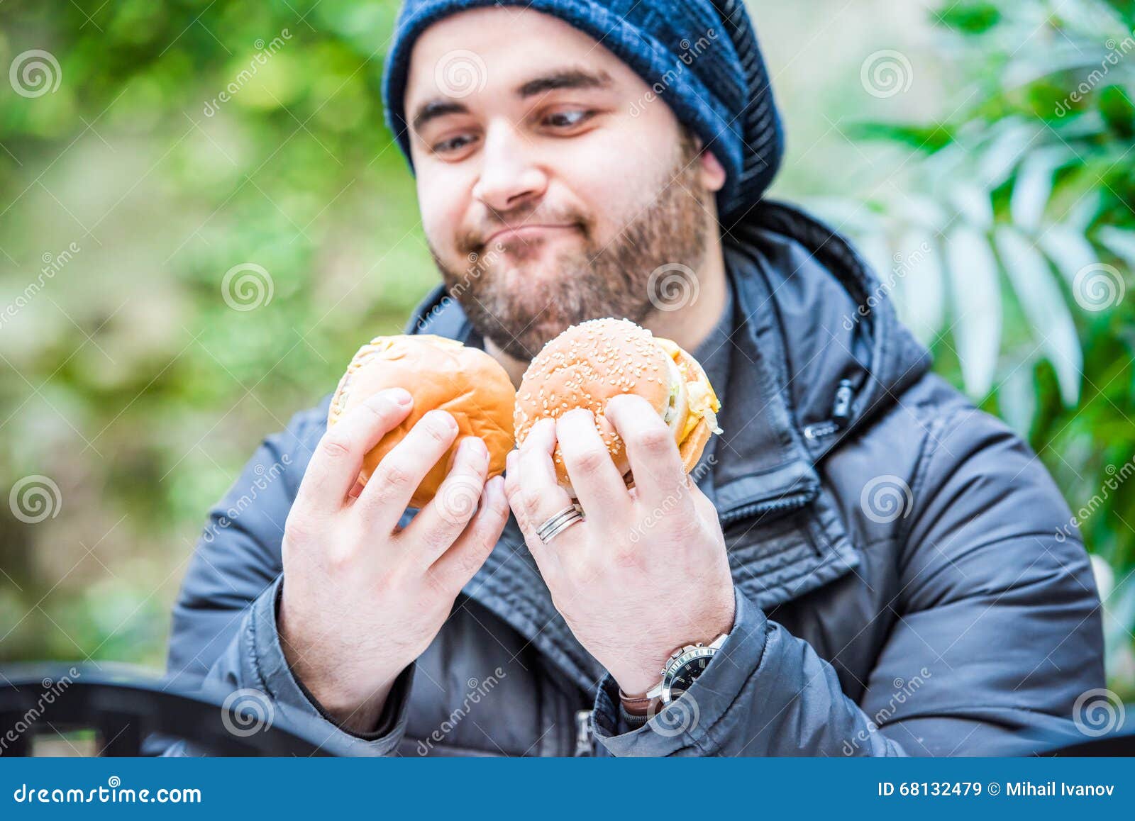 Man Looking At A Burger And Sandwich, Making A Funny Face Stock Image ...