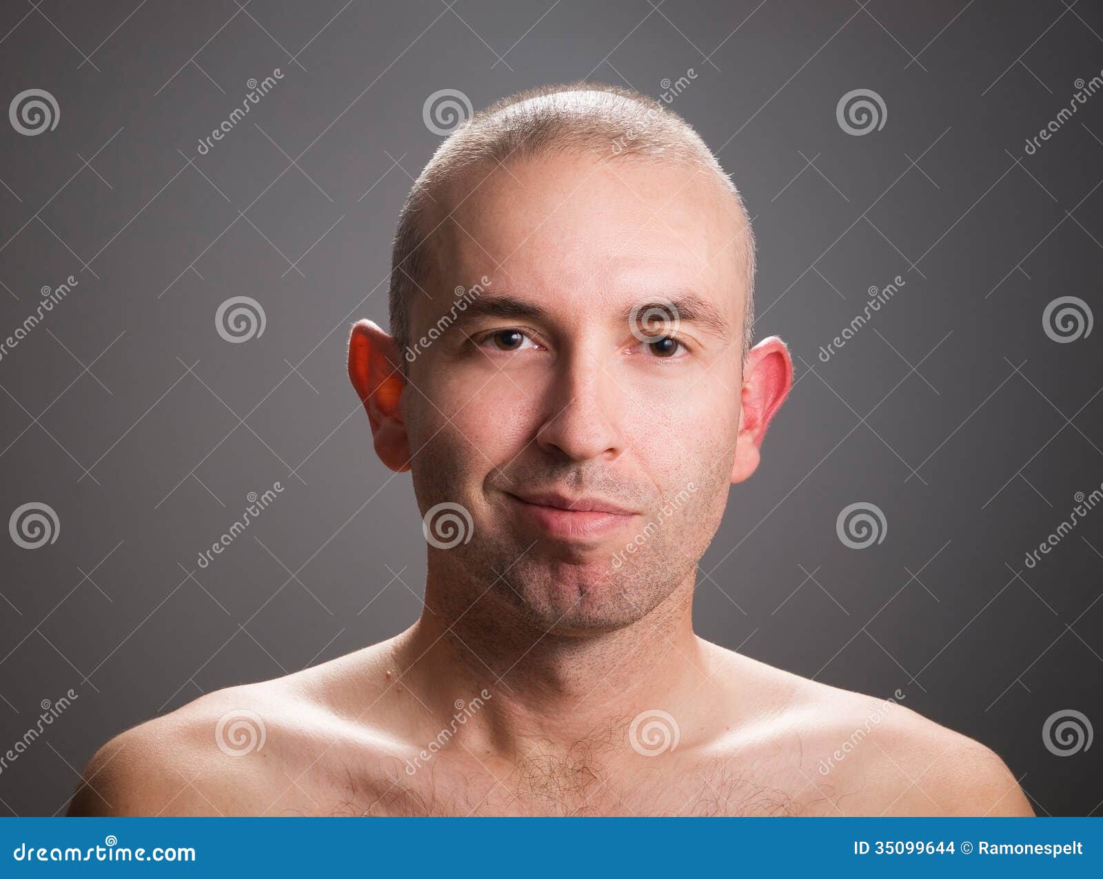 Man Looking at Camera with a Half Smile Stock Photo - Image of studio ...