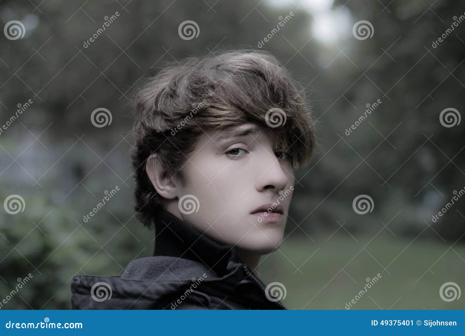 Man Looking at Camera Over Shoulder Stock Image - Image of camera, gaze ...