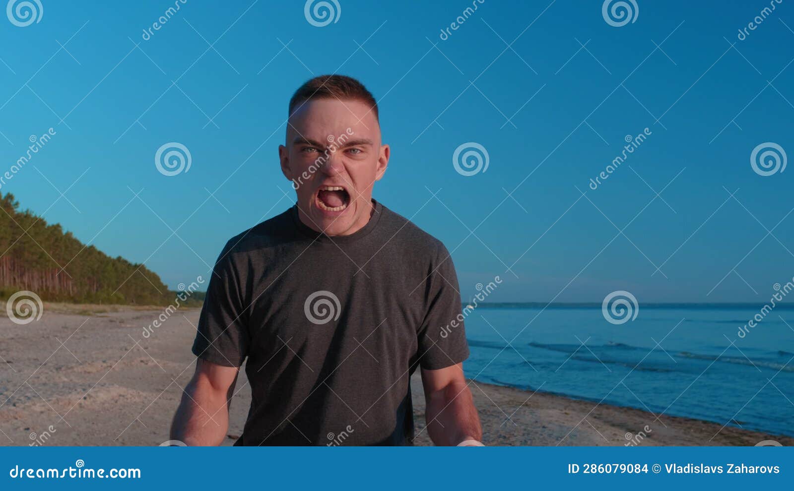 Man Looking into Camera and Screaming Demonstrates Strong Emotional ...