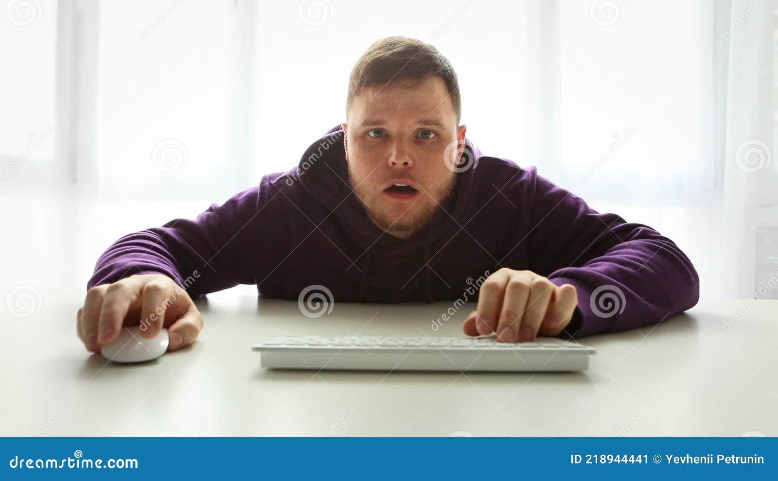 Man Looking at Camera Typing on Keyboard Looking for Information Stock ...