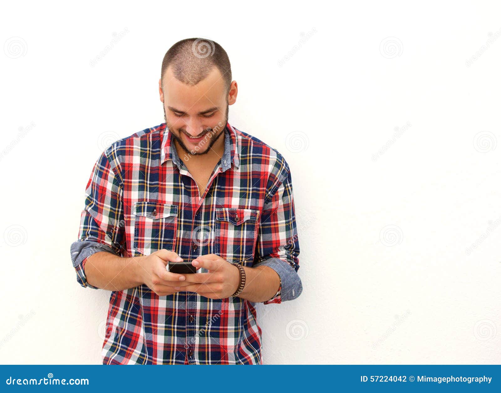 Man Looking at Cell Phone and Smiling Stock Photo - Image of charming ...