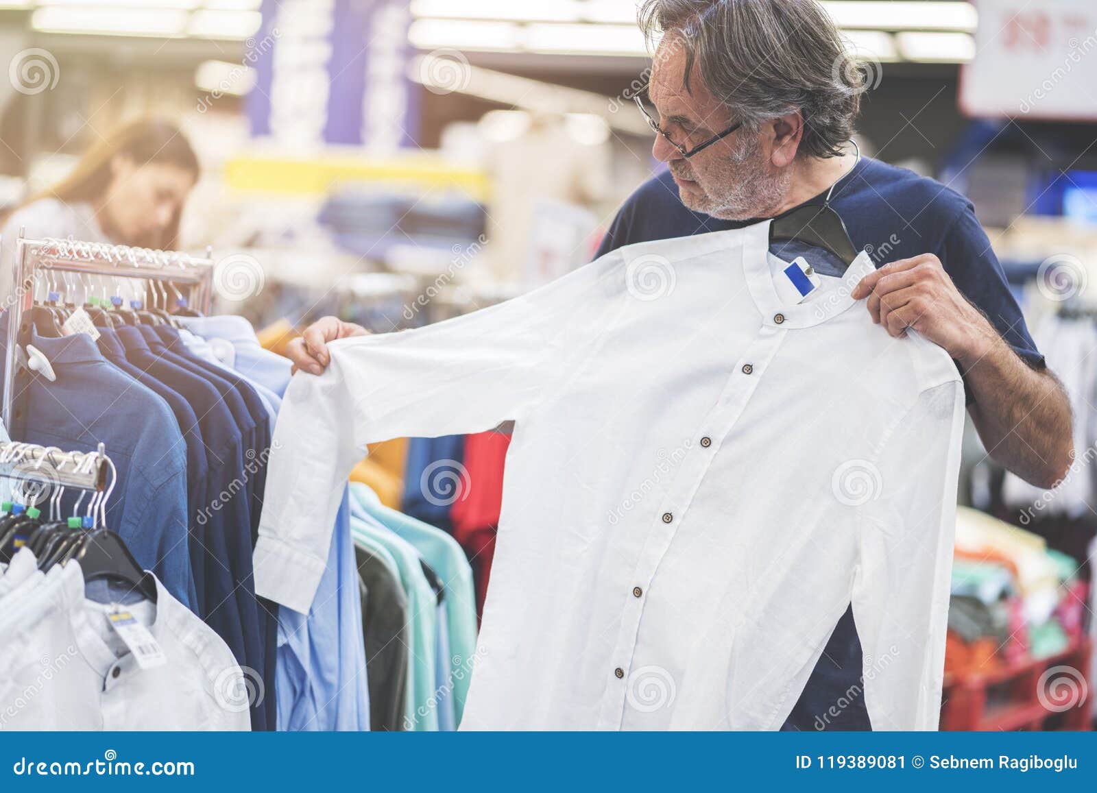Man looking at the clothes stock image. Image of male - 119389081