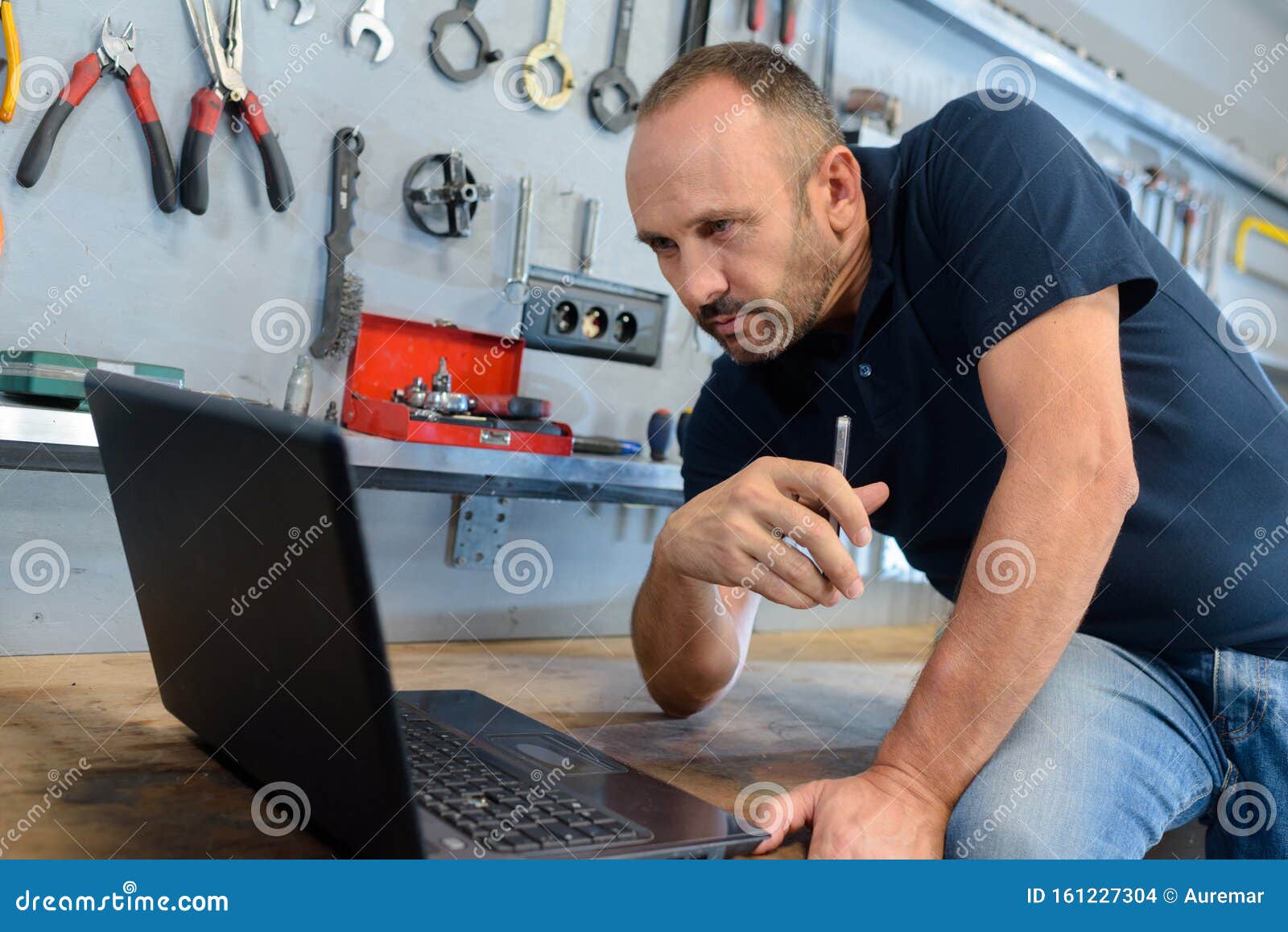 Man Looking Computer in Workshop Stock Photo - Image of wooden ...