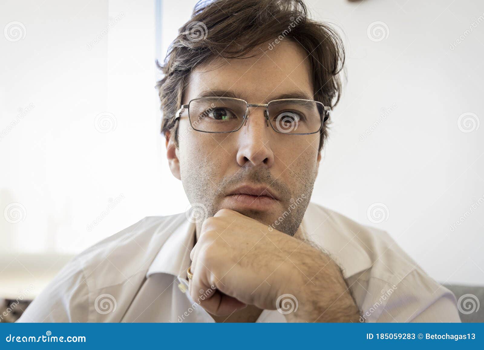 Man Looking Directly at the Camera Making a Conference Call Stock Image ...