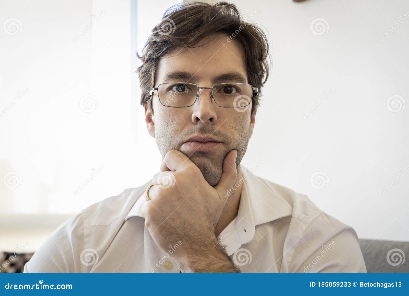 Man Looking Directly at the Camera Making a Conference Call Stock Image ...