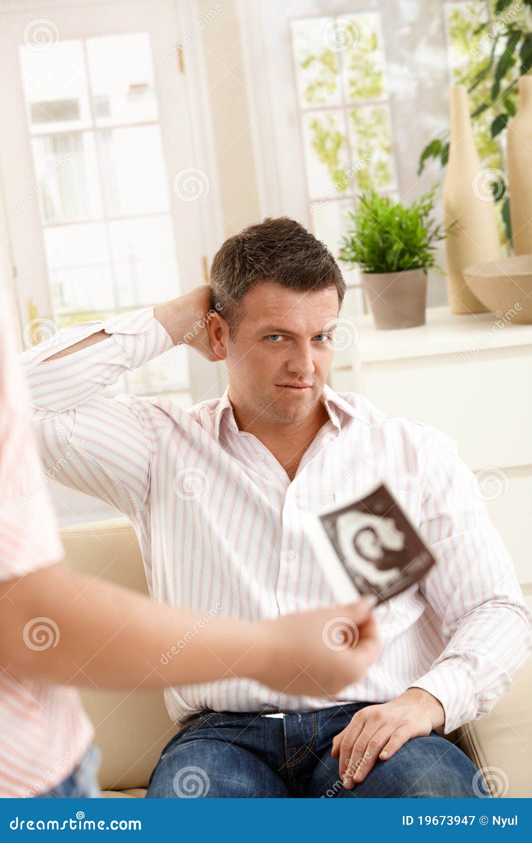 Man Looking Disbelieving at Ultrasound Picture Stock Image - Image of ...