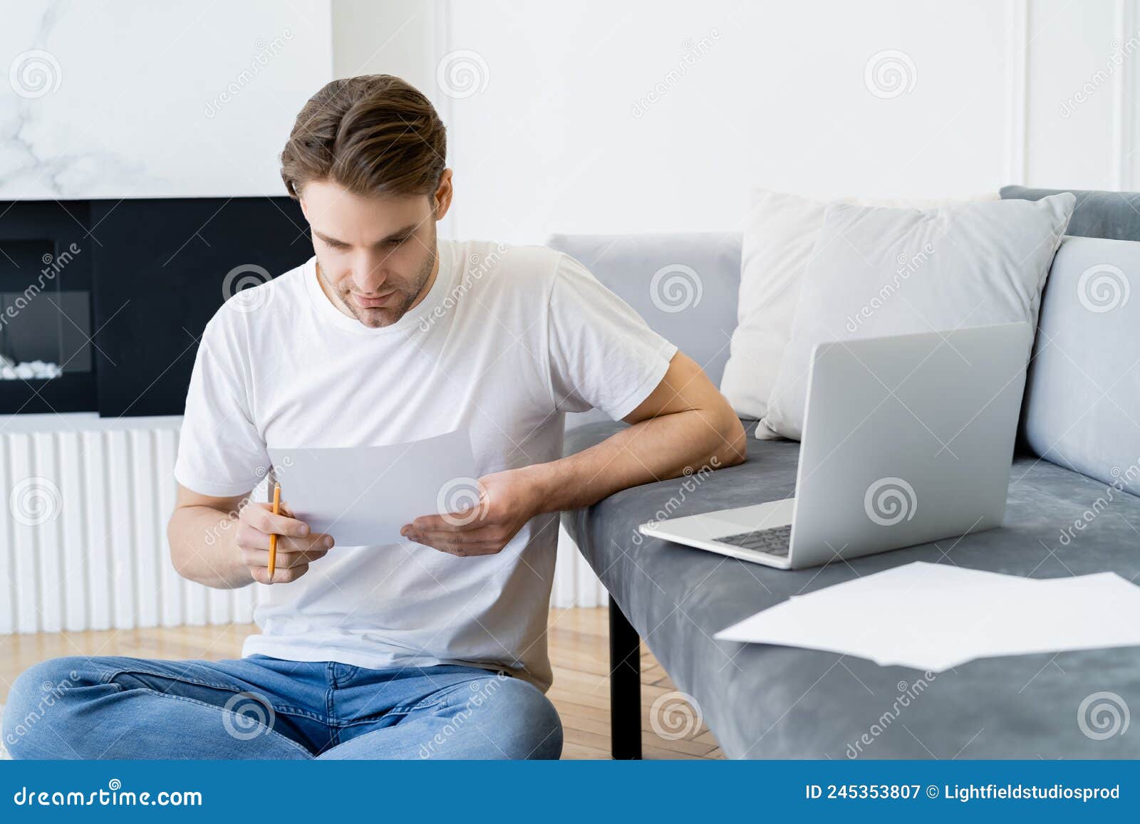 Man Looking at Document while Sitting Stock Image - Image of online ...