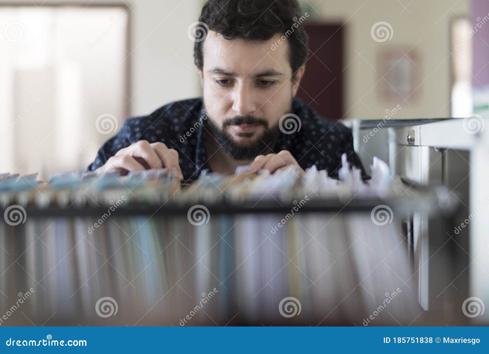 Man Looking in a Documentation File Drawer Stock Photo - Image of adult ...