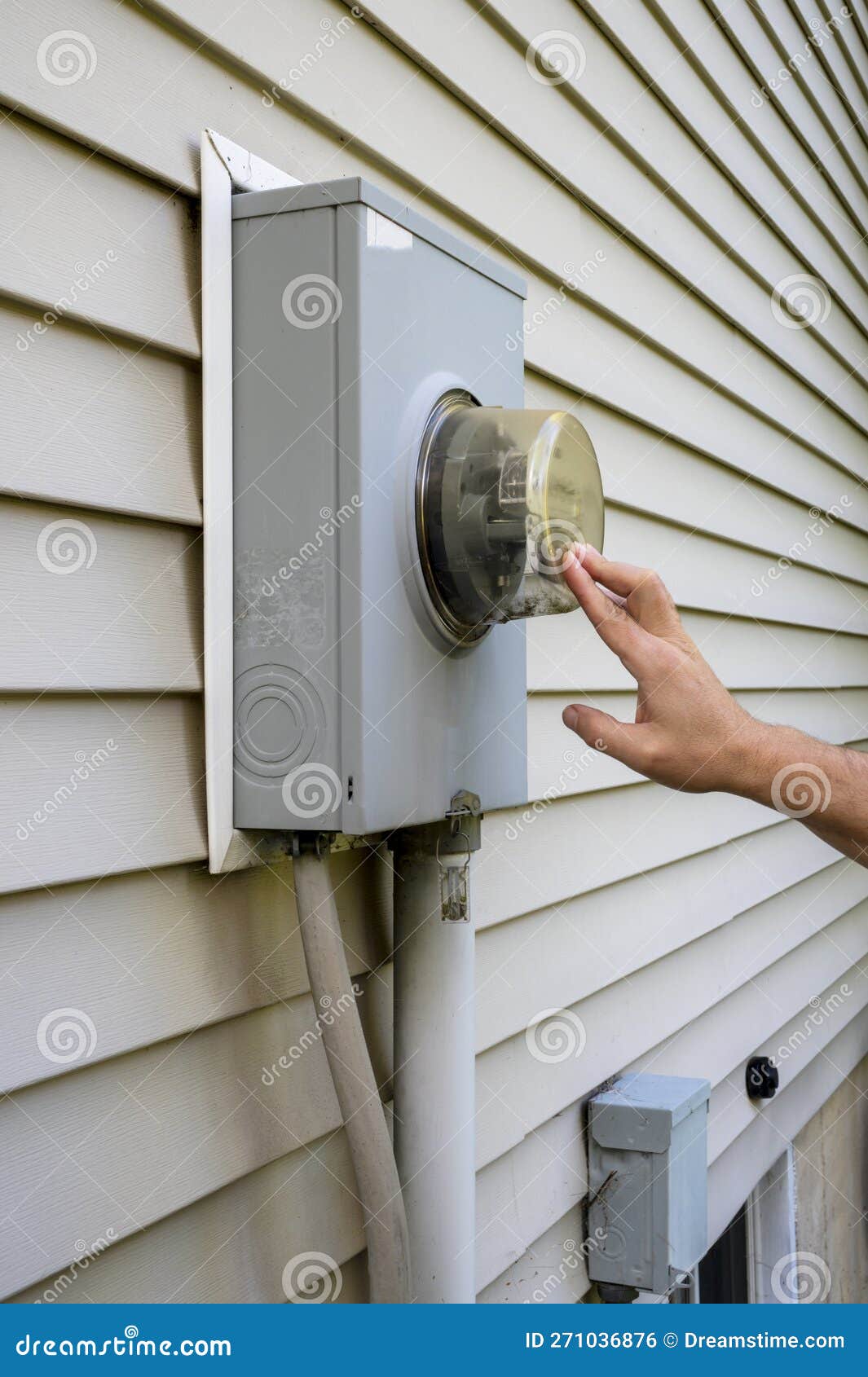 Man Looking at Electricity Meter at Home. Electric Power Box Meter for ...