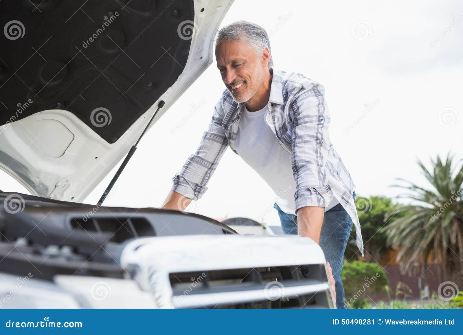 Man looking at engine stock image. Image of checking - 50490281