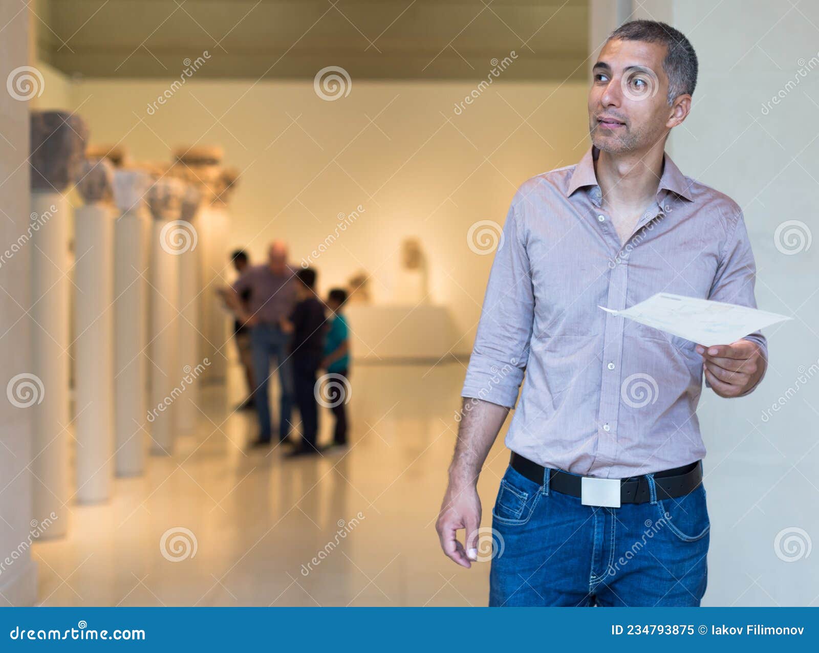 Man is Looking at the Exposition with Brochure Stock Image - Image of ...