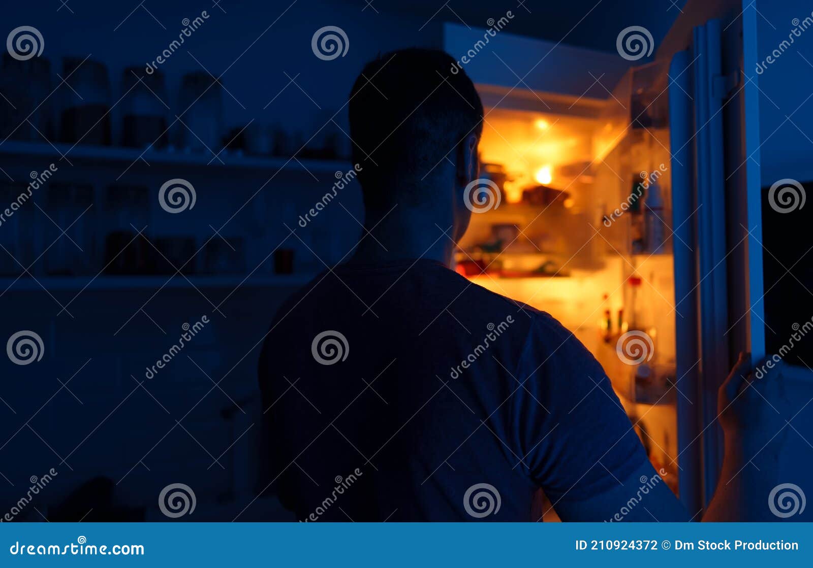 Man looking for food stock photo. Image of male, hungry - 210924372