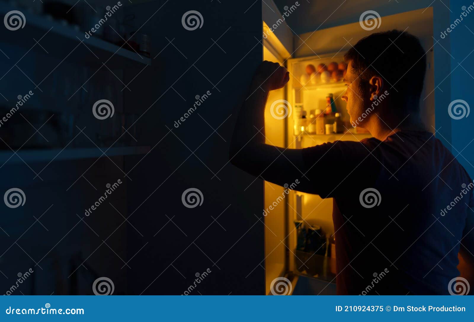 Man looking for food stock image. Image of light, interior - 210924375