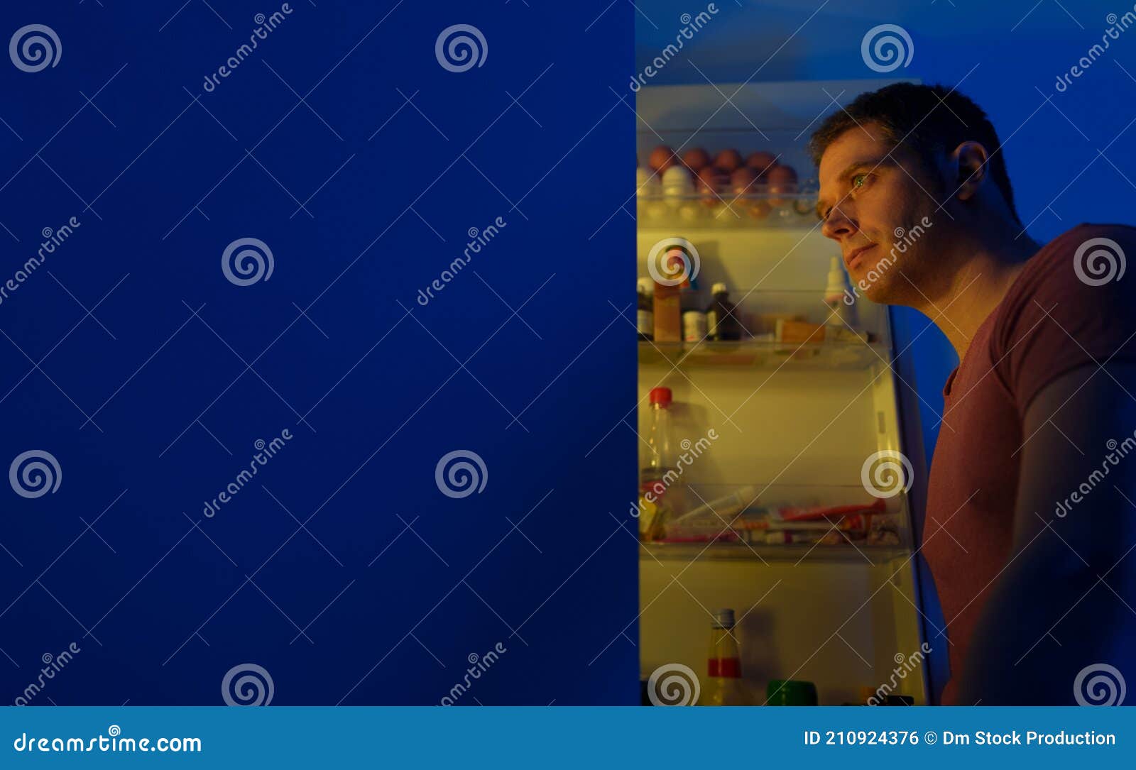 Man looking for food stock photo. Image of indoors, diet - 210924376