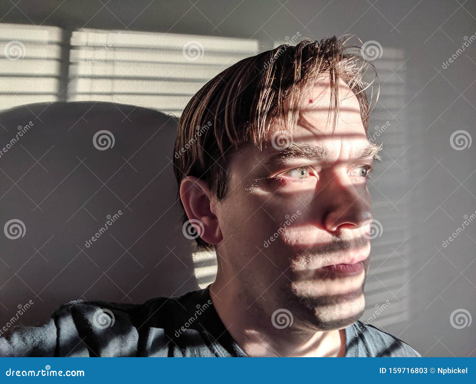 Man Looking into the Future through Bars of Shadow and Light Stock ...