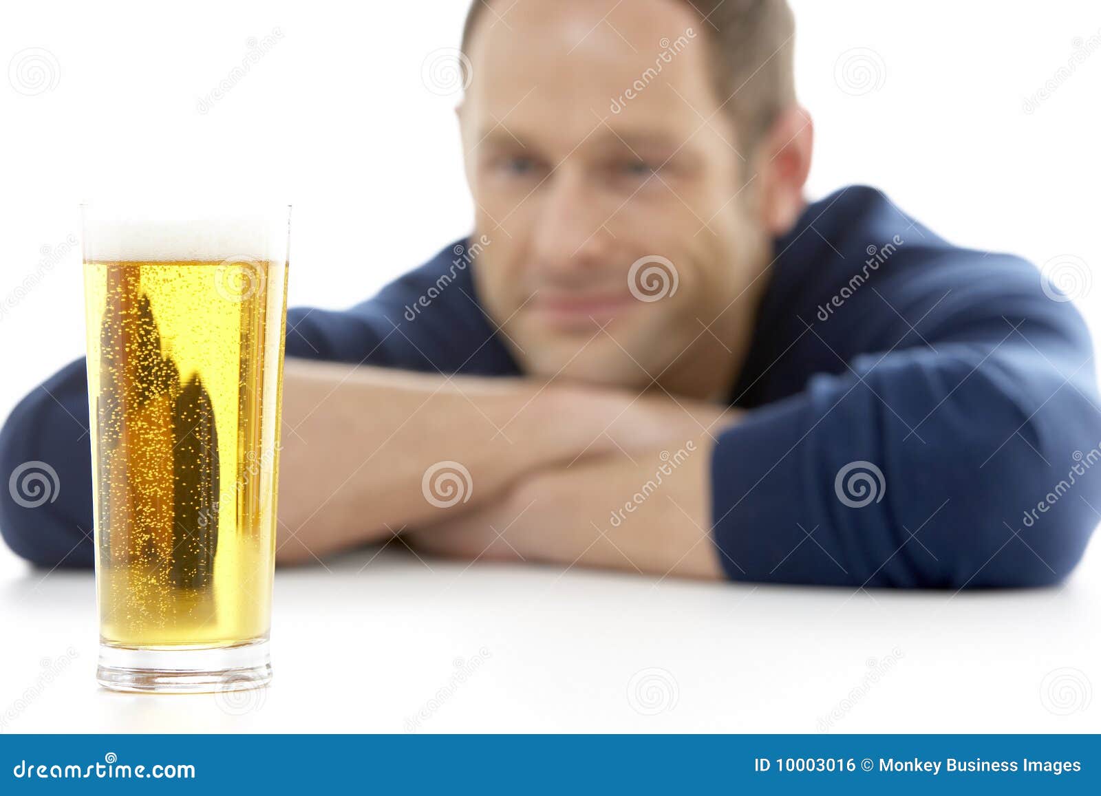 Man Looking at Glass of Beer Stock Photo - Image of thirsty, indoors ...