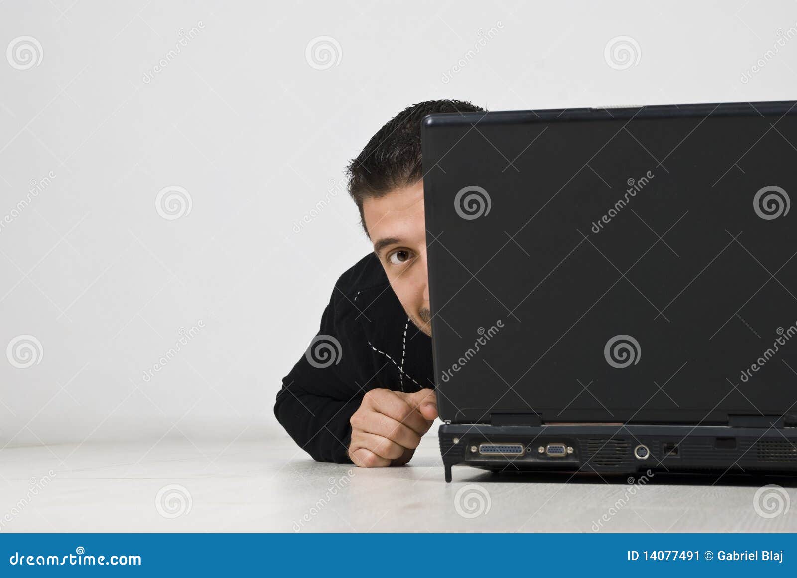 Man Looking and Hiding Behind Laptop Stock Image - Image of face ...
