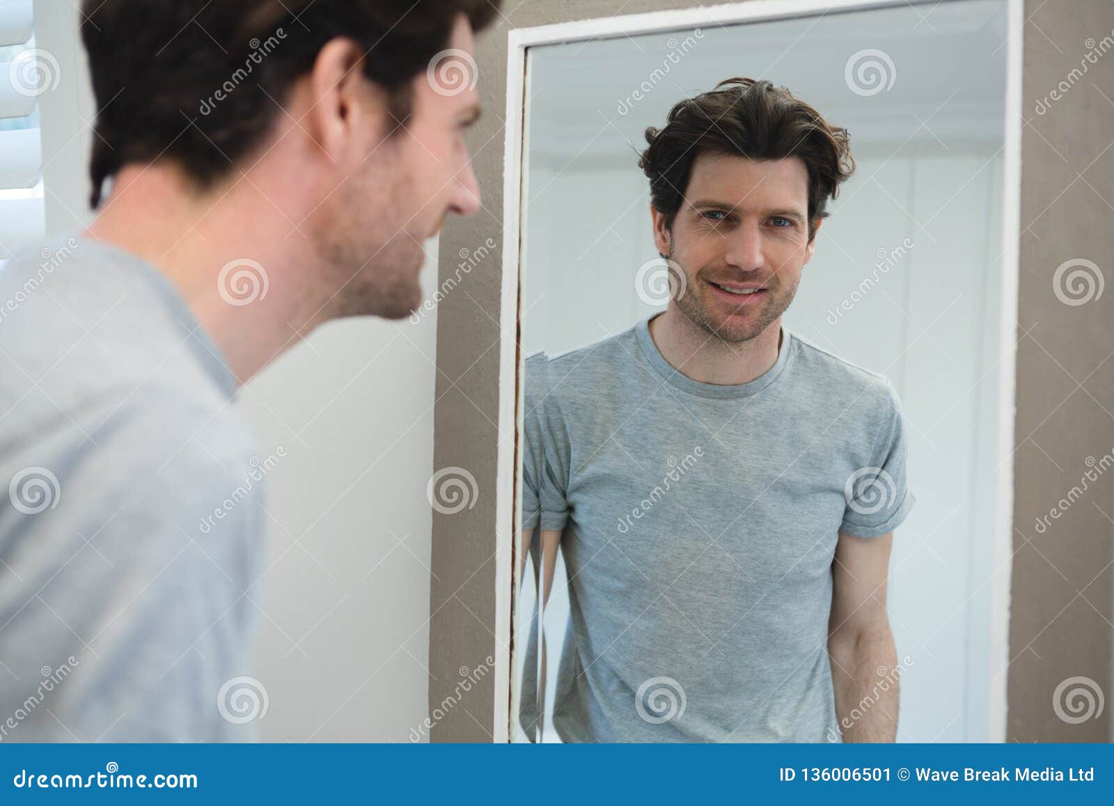 Man Looking His Face in Mirror Stock Image - Image of apartment ...