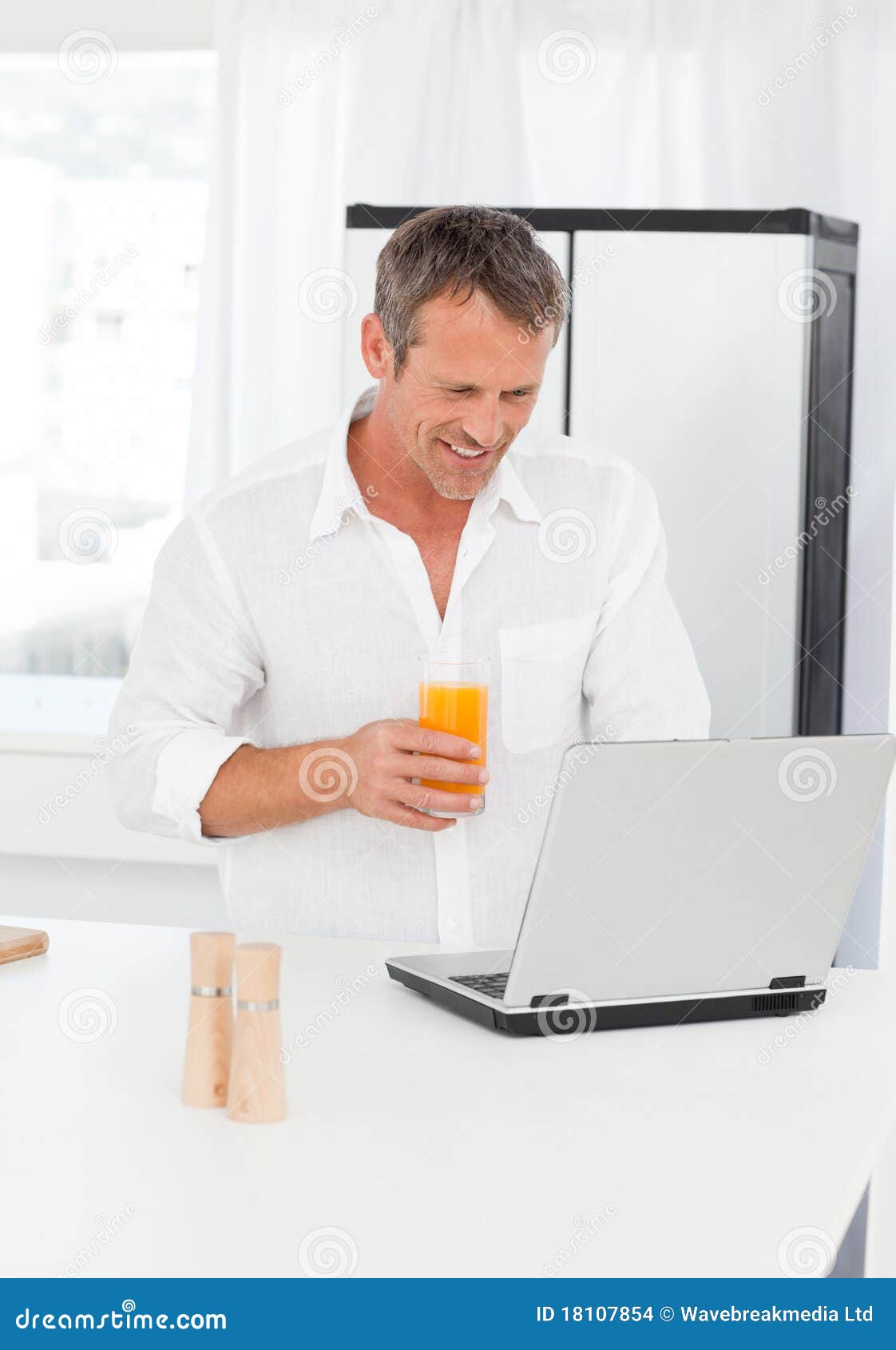 Man looking at his laptop stock photo. Image of globalization - 18107854