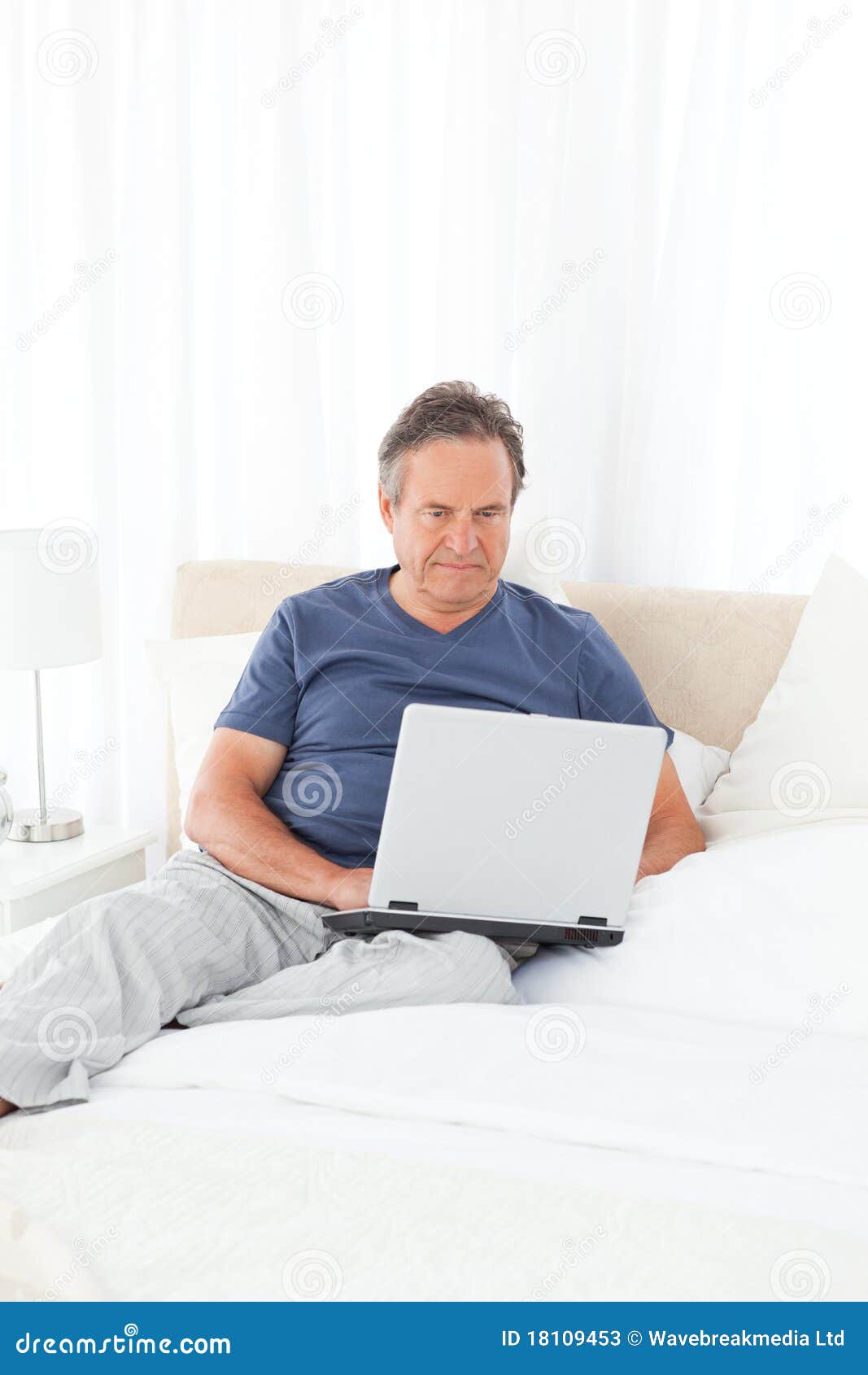 Man looking at his laptop stock image. Image of maturity - 18109453