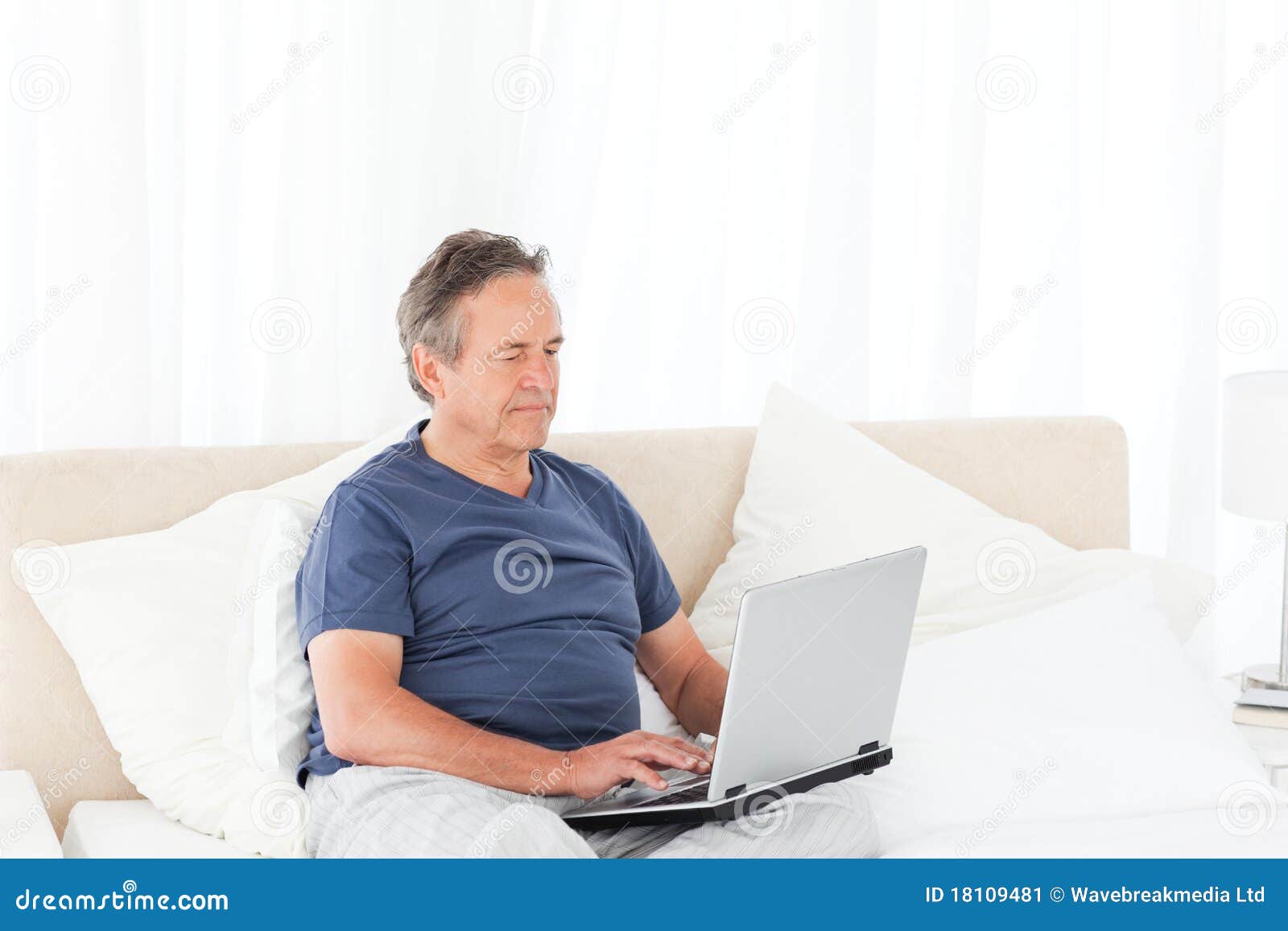 Man looking at his laptop stock image. Image of healthy - 18109481