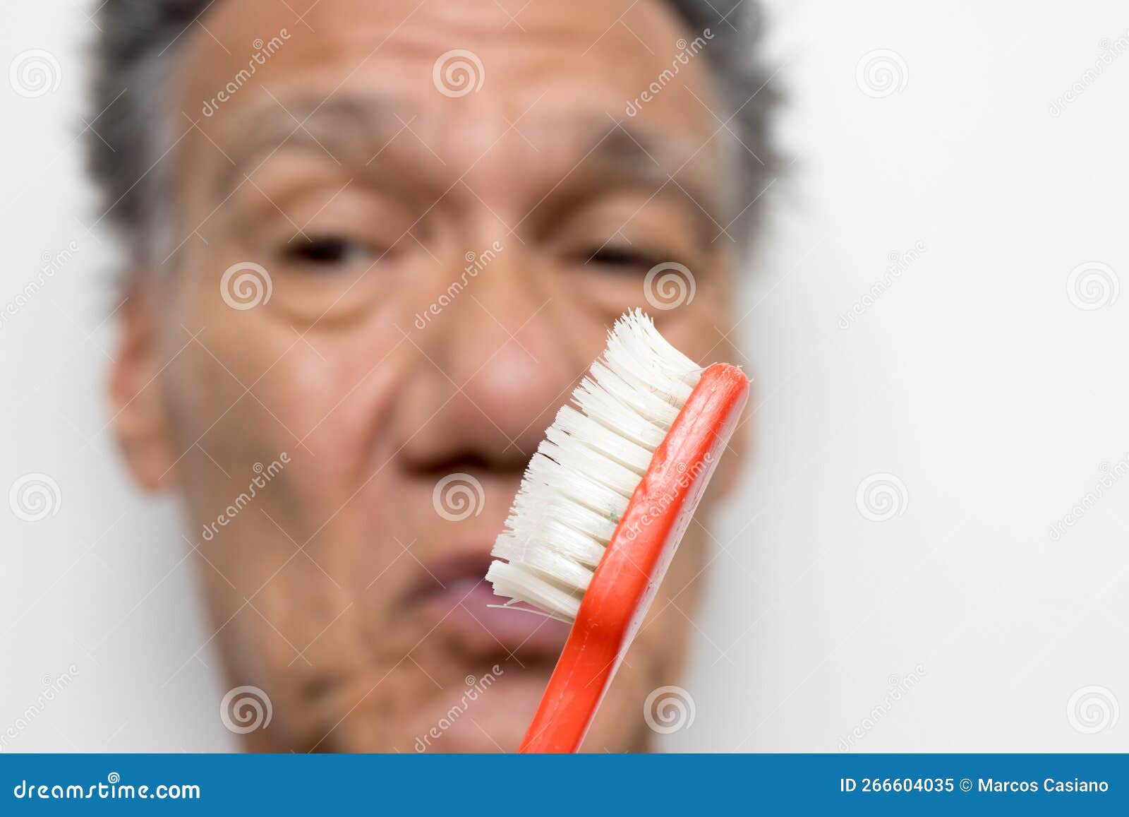 Man Looking at His Old Worn Our Toothbrush Stock Image - Image of used ...