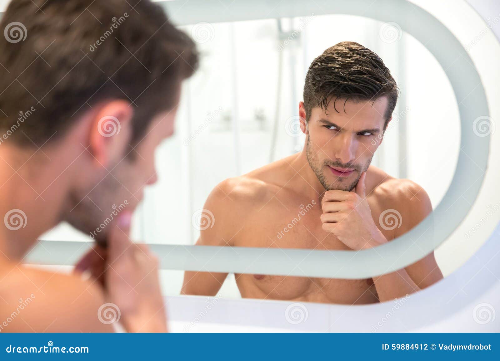 Man Looking at His Reflection in the Mirror Stock Photo - Image of ...
