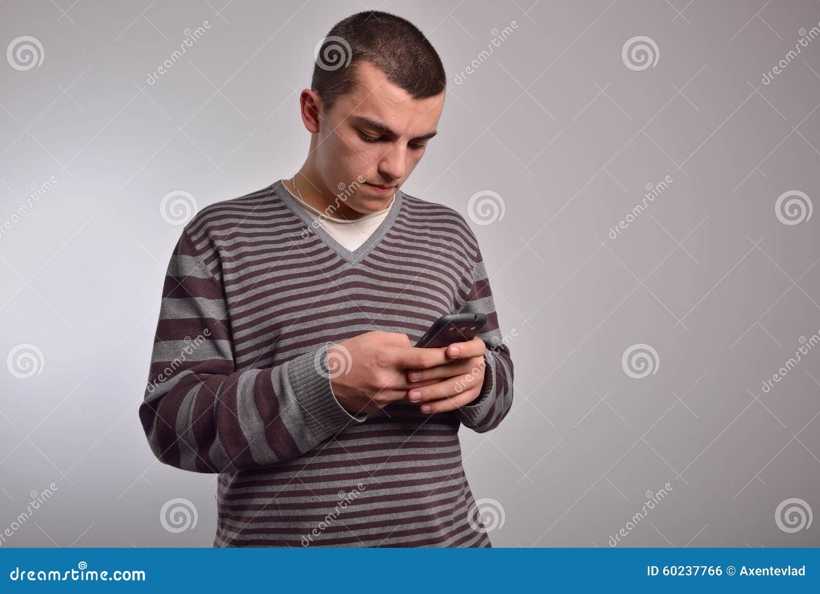 Man Looking at His Smart Phone while Text Messaging Stock Photo - Image ...