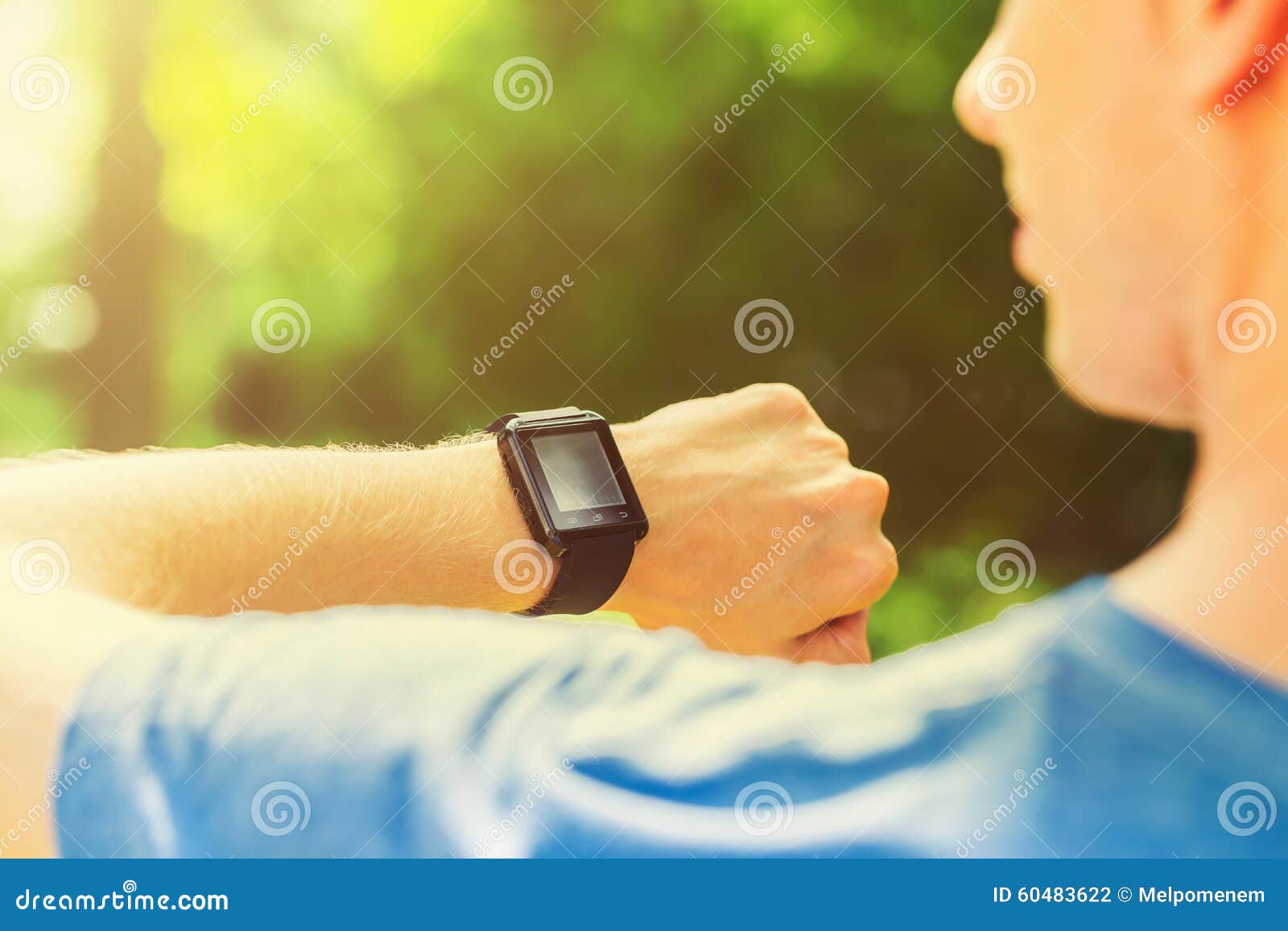 Man Looking at His Smart Watch Outside Stock Photo - Image of smart ...