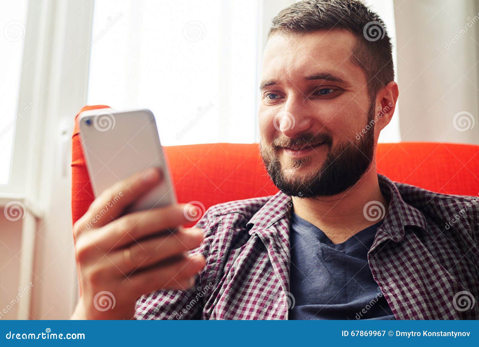 Man Looking At His Smartphone And Smiling Stock Image Image Of