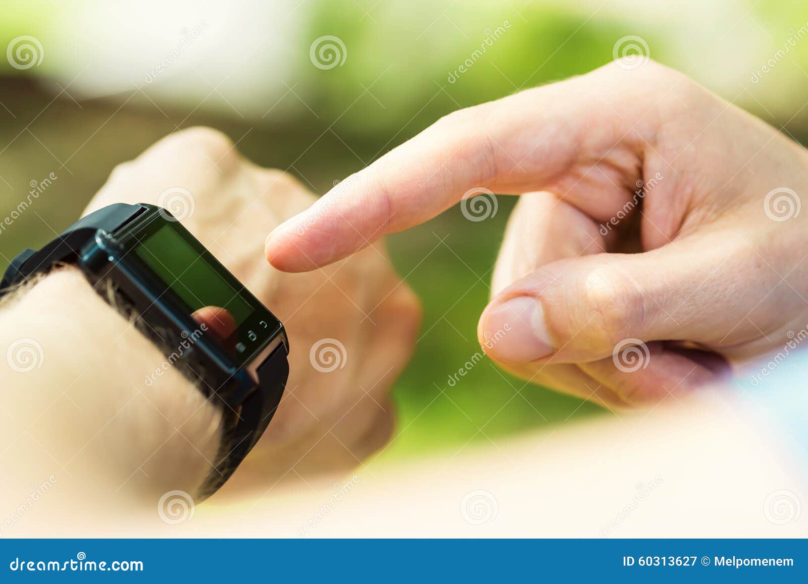 Man Looking at His Smartwatch Stock Image - Image of nature, sport ...