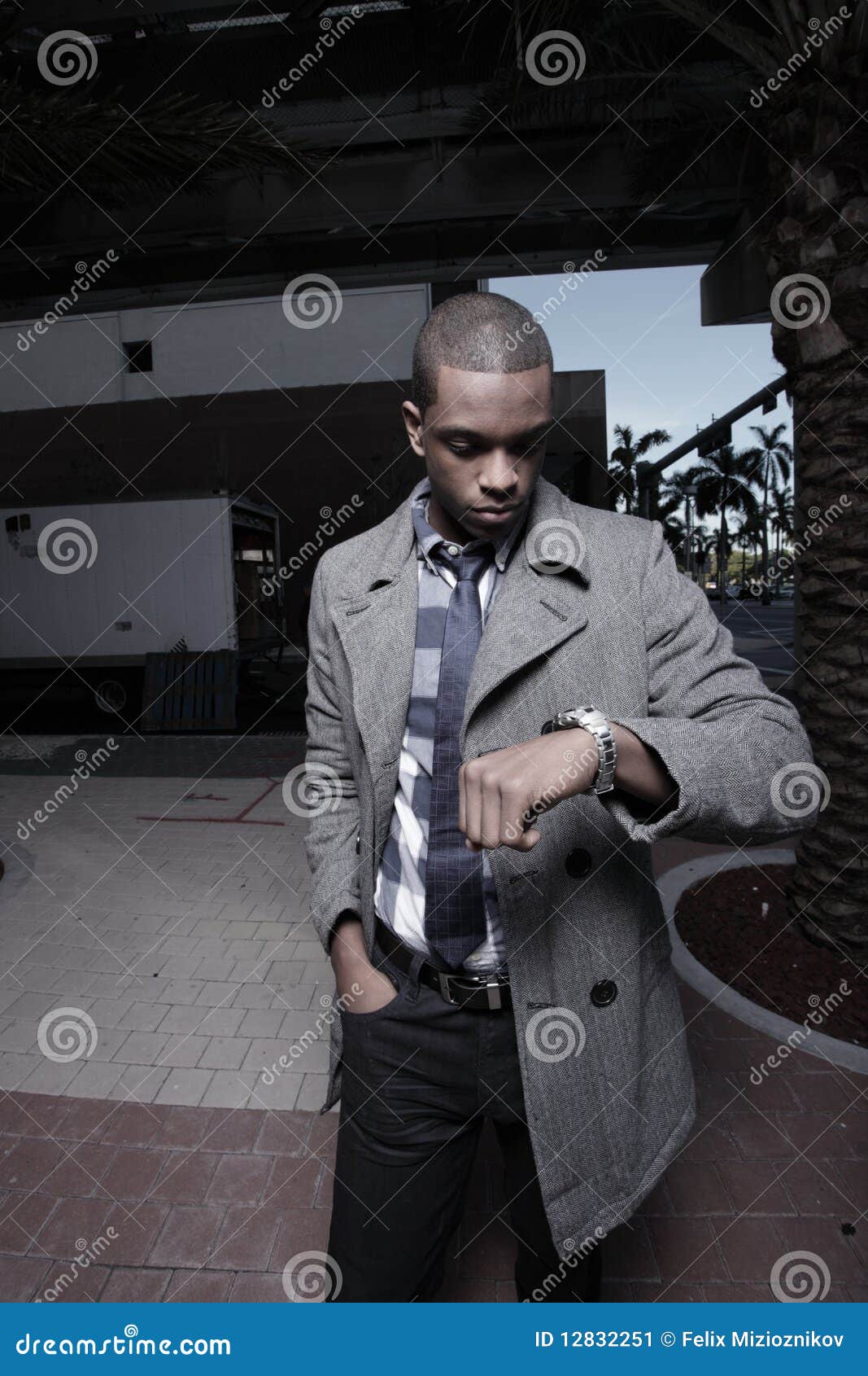 Man looking at his watch stock image. Image of american - 12832251