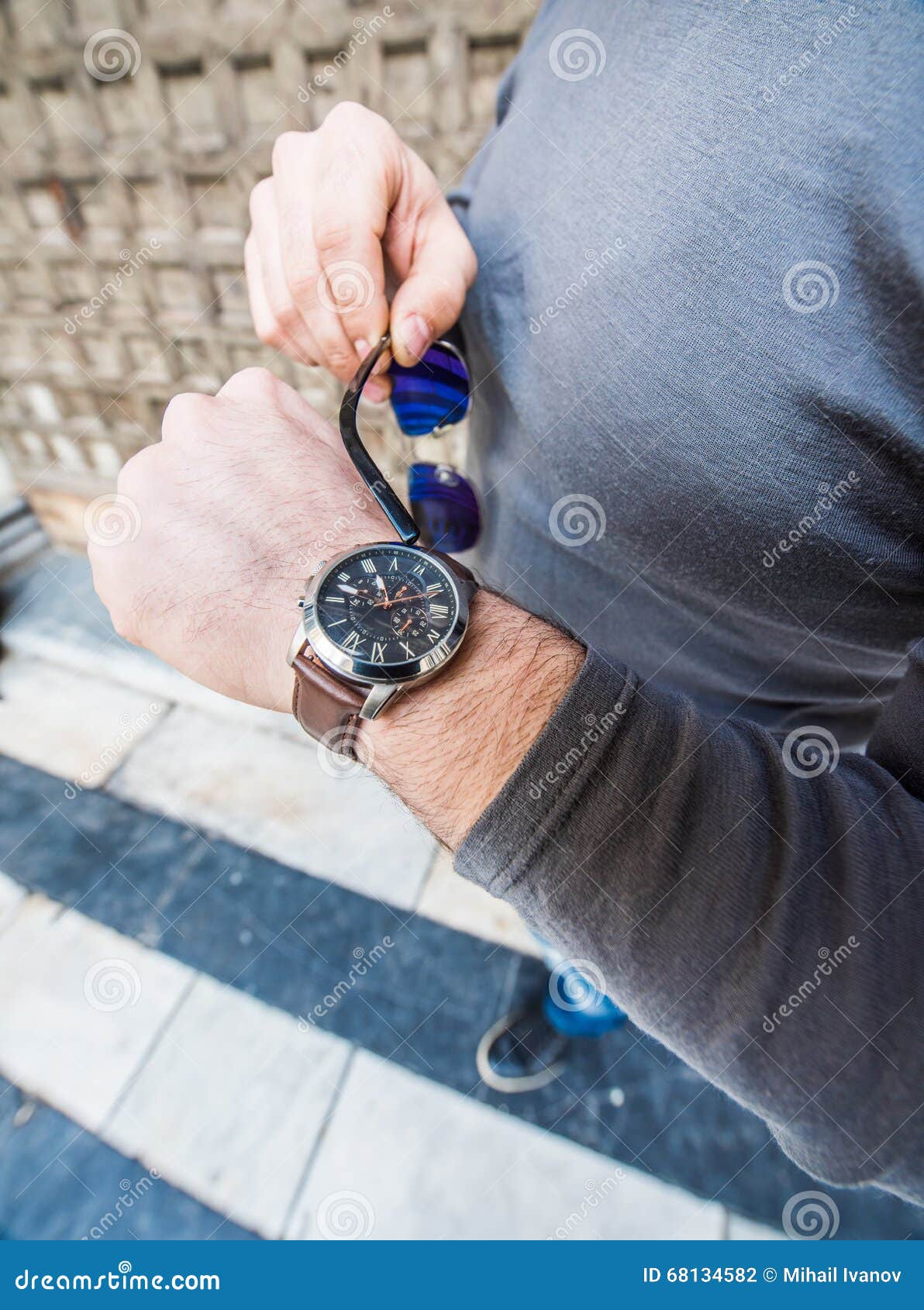Man Looking at His Watch - Pointing with Sunglasses Stock Photo - Image ...