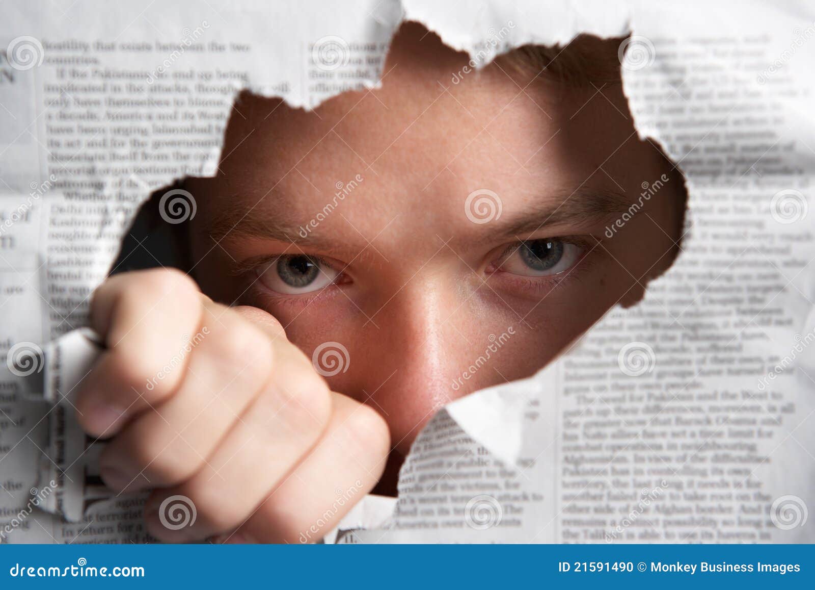 Man Looking through Hole in Newspaper Stock Photo - Image of person ...