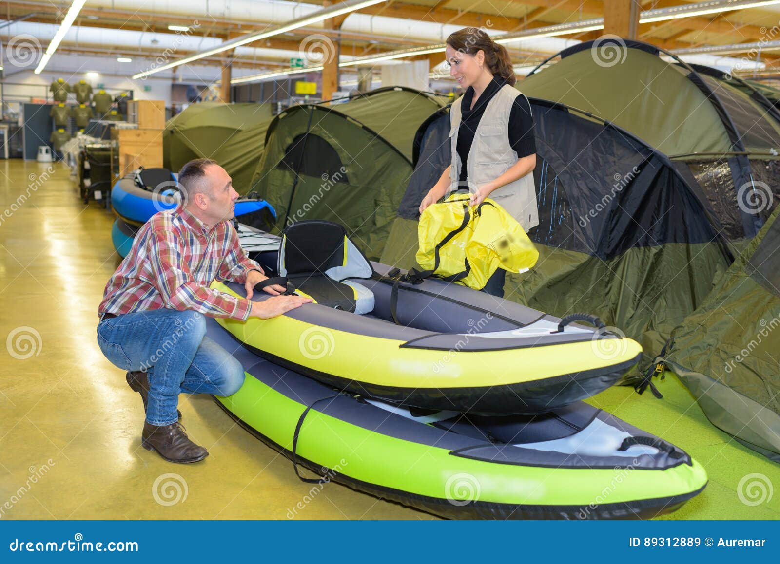 Man Looking at Inflatable Dingys in Shop Stock Image - Image of ...