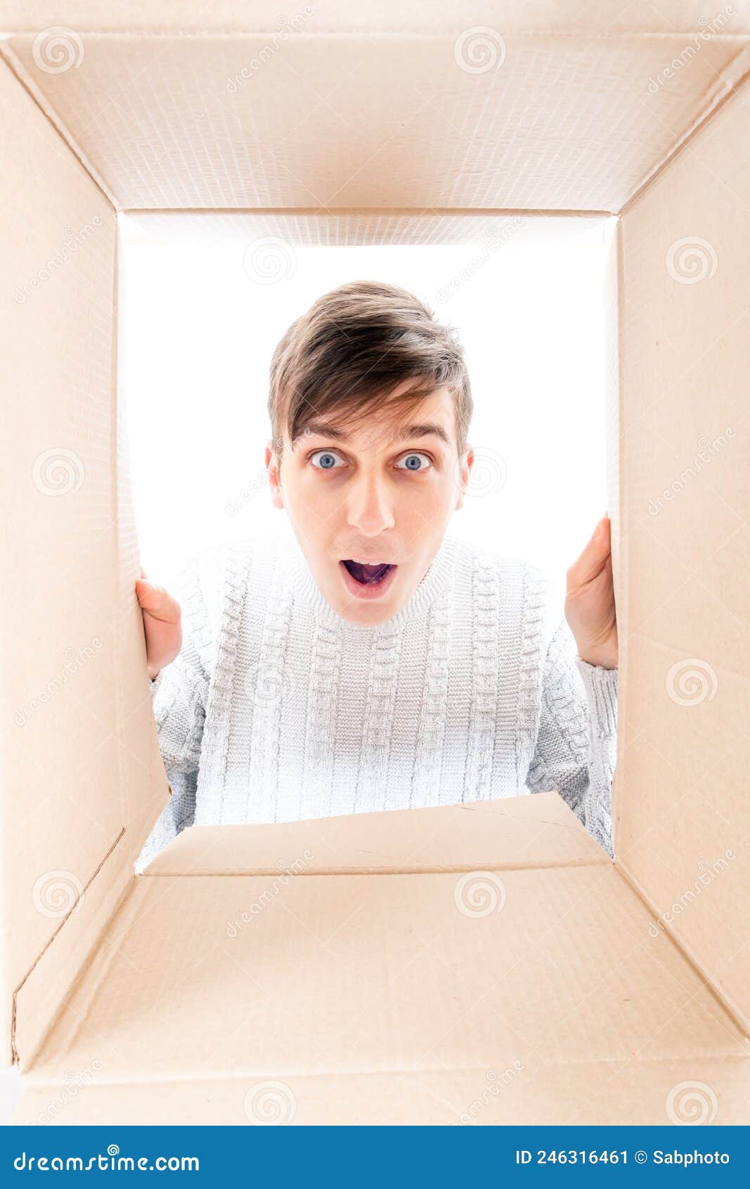 Man looking inside a box stock image. Image of closeup - 246316461