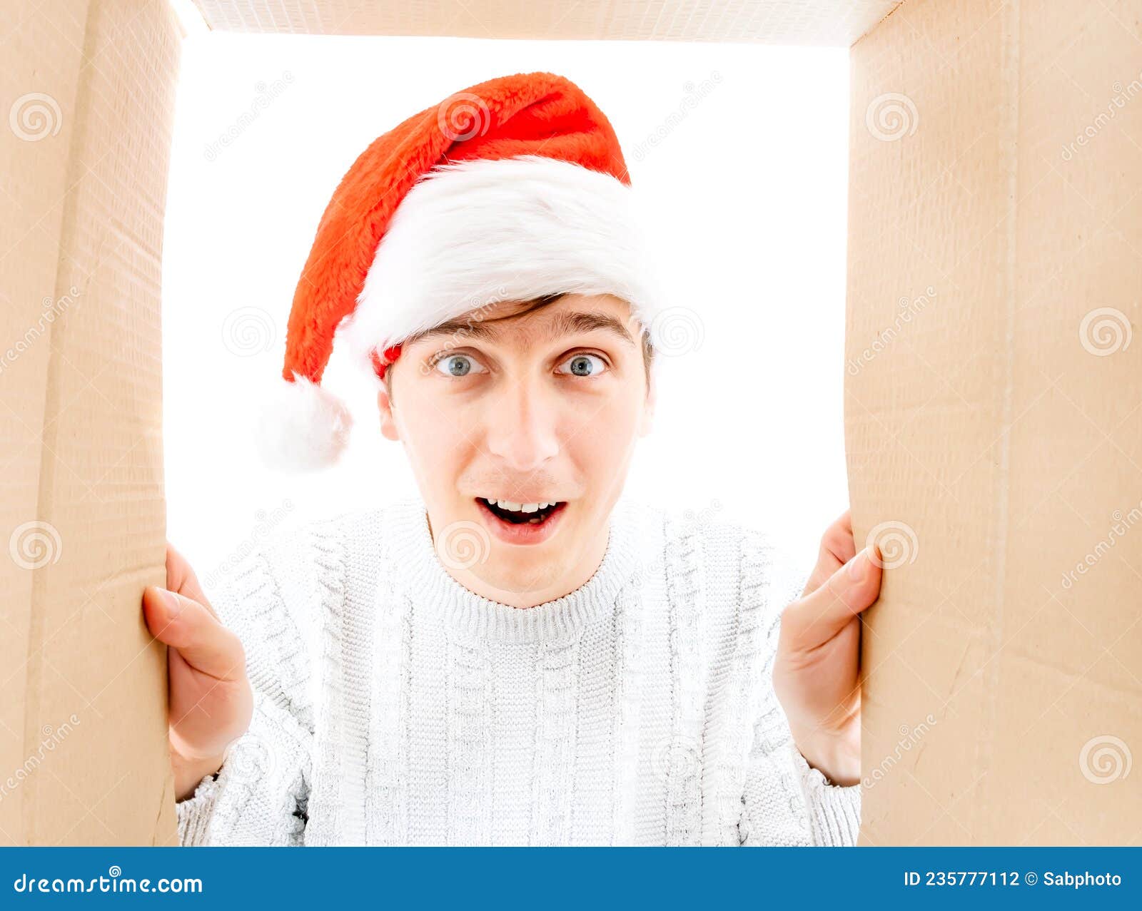 Man looking inside a box stock photo. Image of male - 235777112