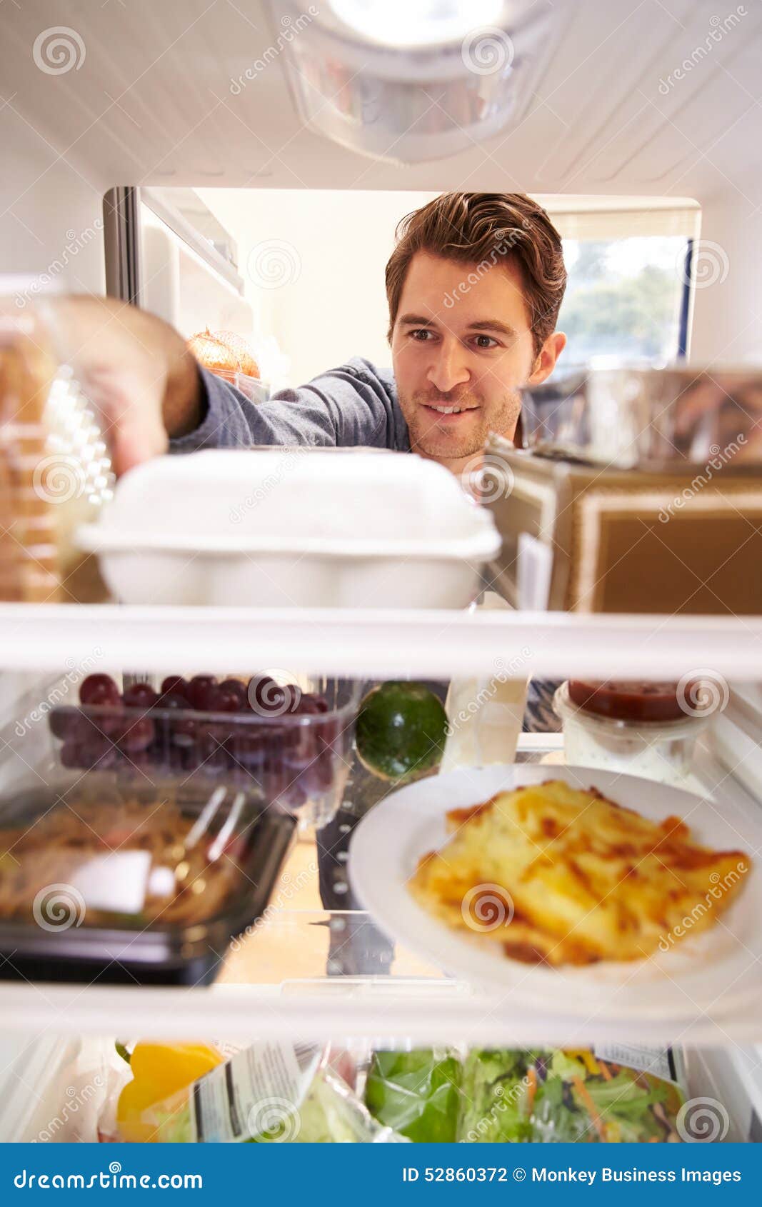 Man Looking Inside Fridge Filled with Food Stock Photo - Image of ...