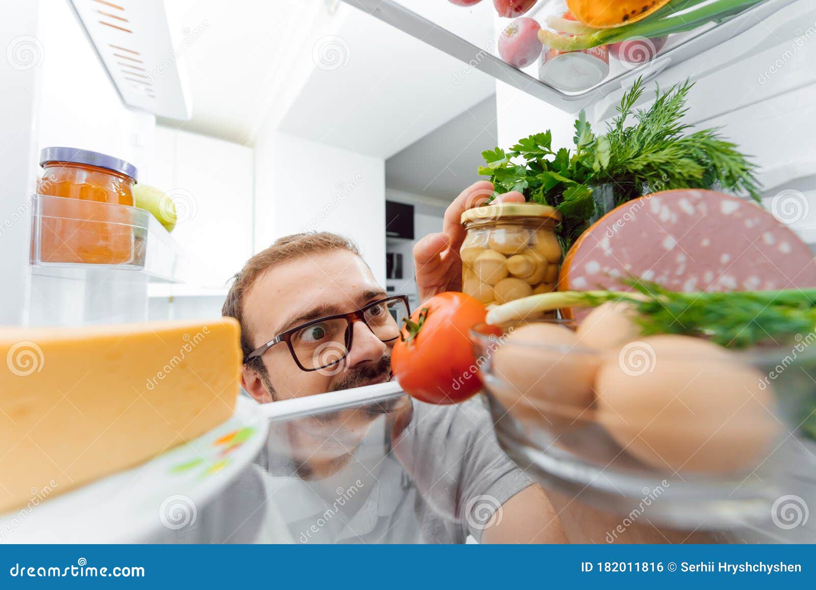 Man Looking Inside Fridge Full of Food Stock Photo - Image of bowl ...