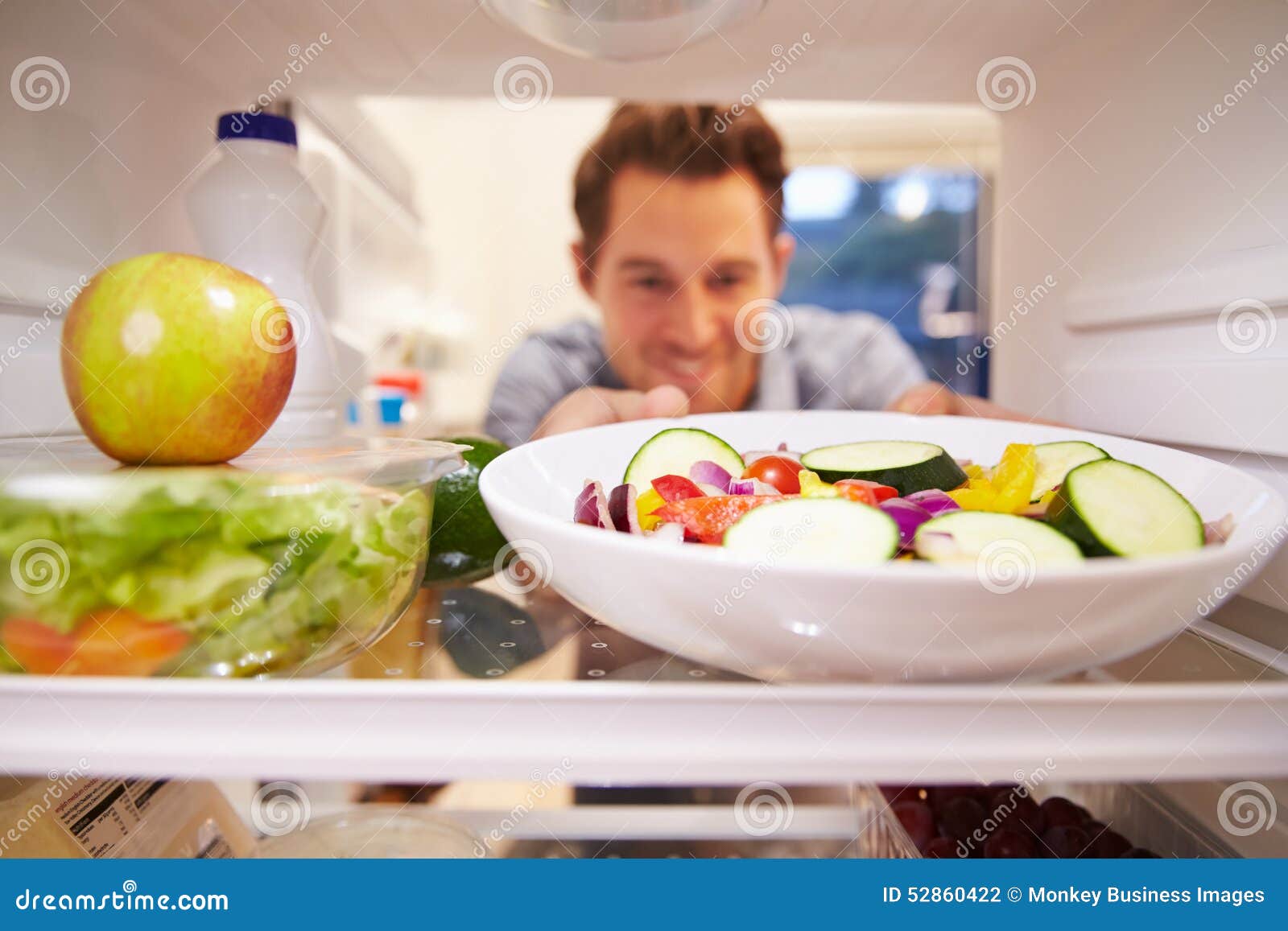 Man Looking Inside Fridge Full of Food and Choosing Salad Stock Photo ...