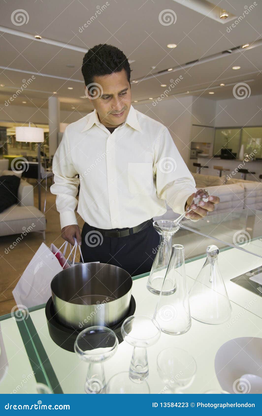 Man Looking at Kitchenware in Furniture Store Stock Image - Image of ...