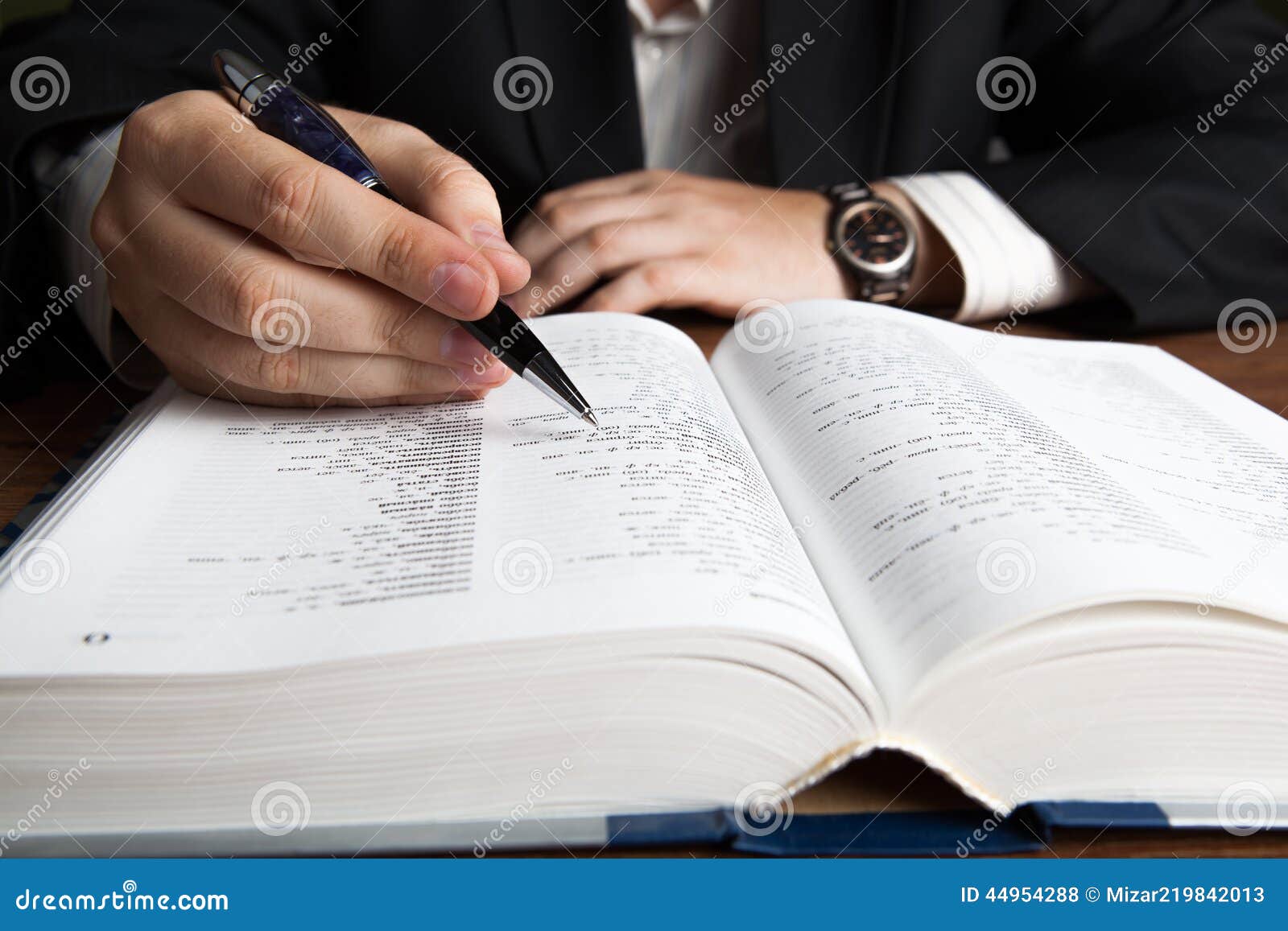 Man Looking in the Large Dictionary Stock Photo - Image of information ...