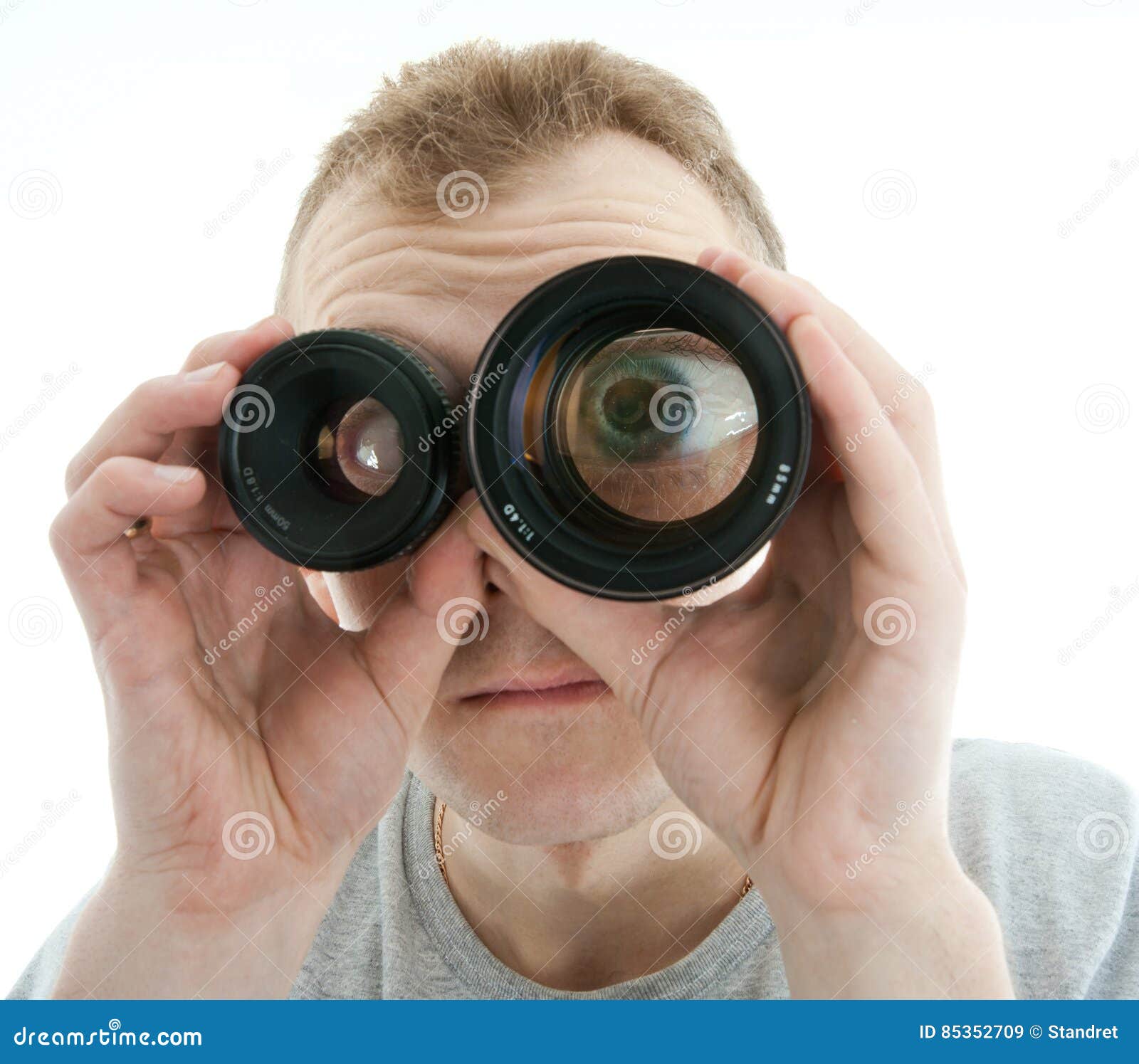 Man looking through a lens stock image. Image of scientific - 85352709
