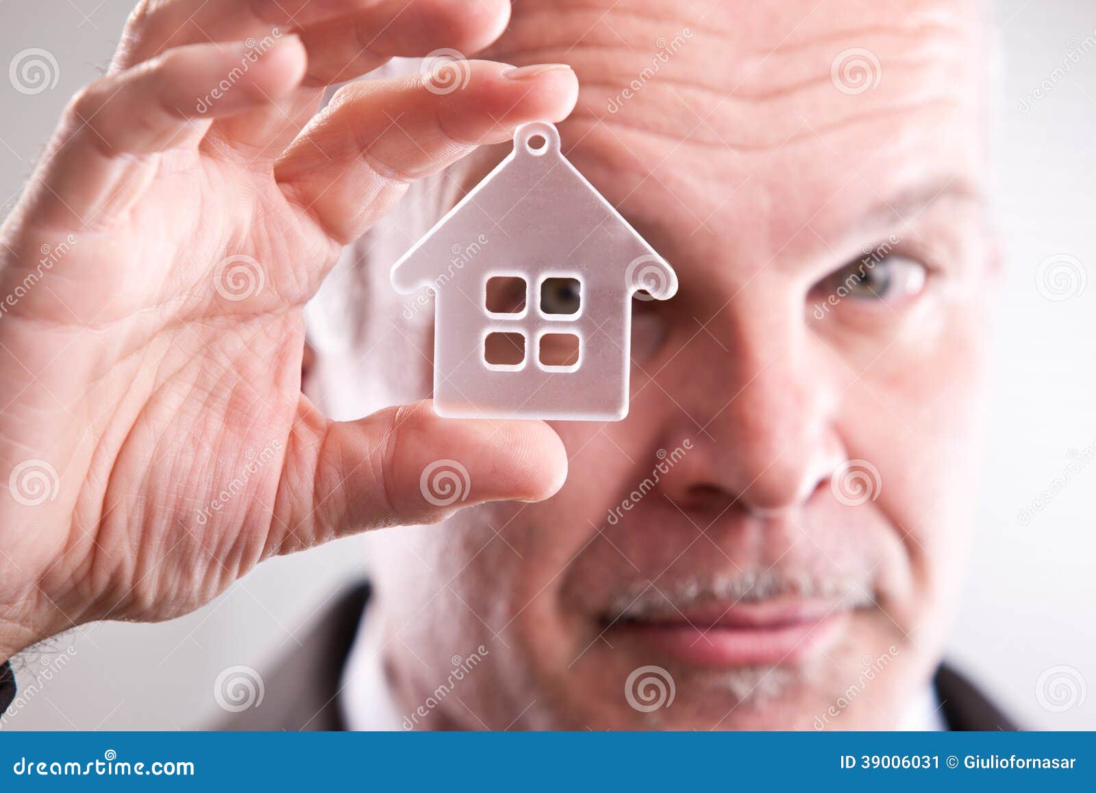 Man Looking through a Little House in Front of You Stock Image - Image ...