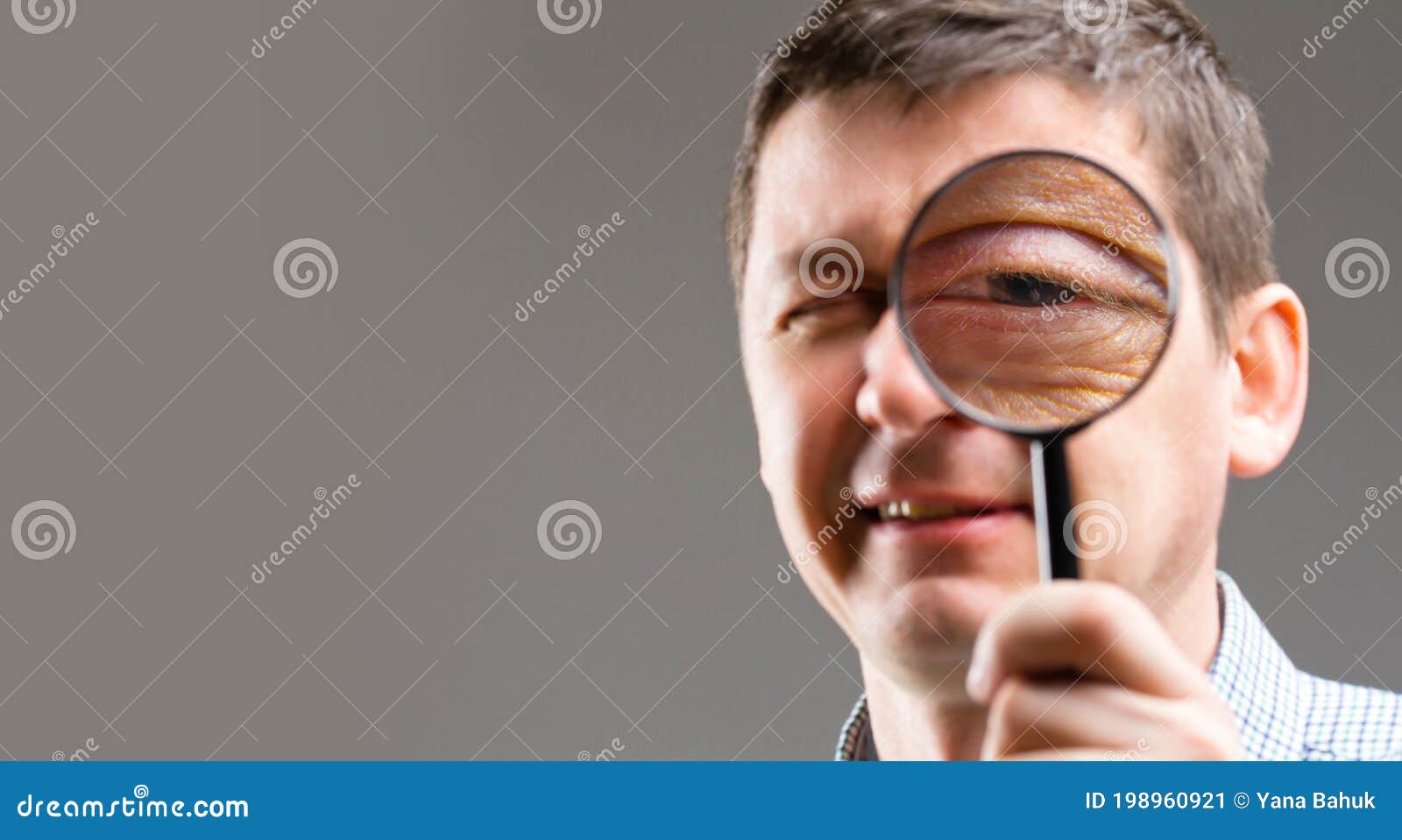 A Man Looking through a Magnifying Glass. Investigation. Stock Image ...
